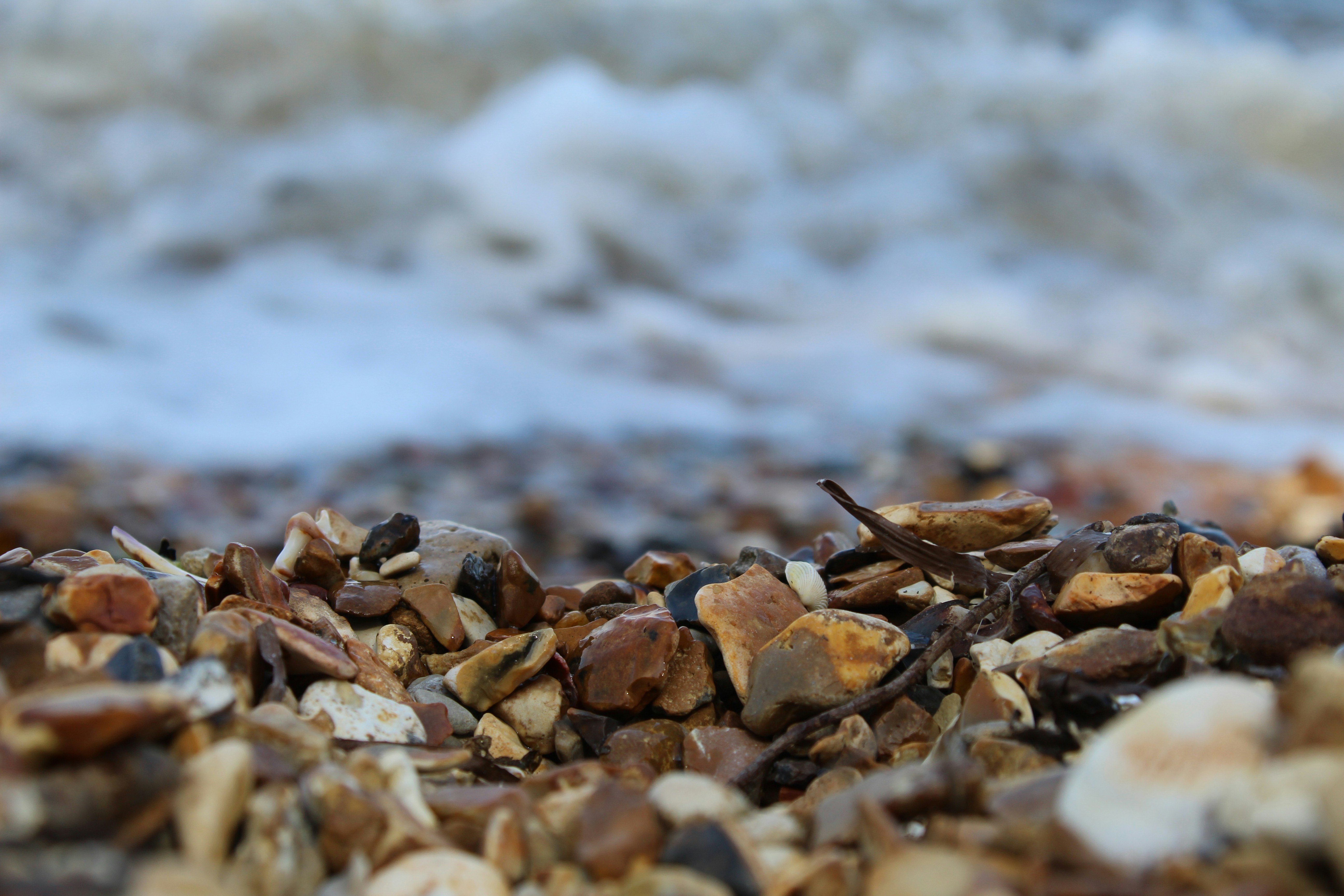 Pebble Beach Edge: Soft Waves Behind a Pebble Scatter