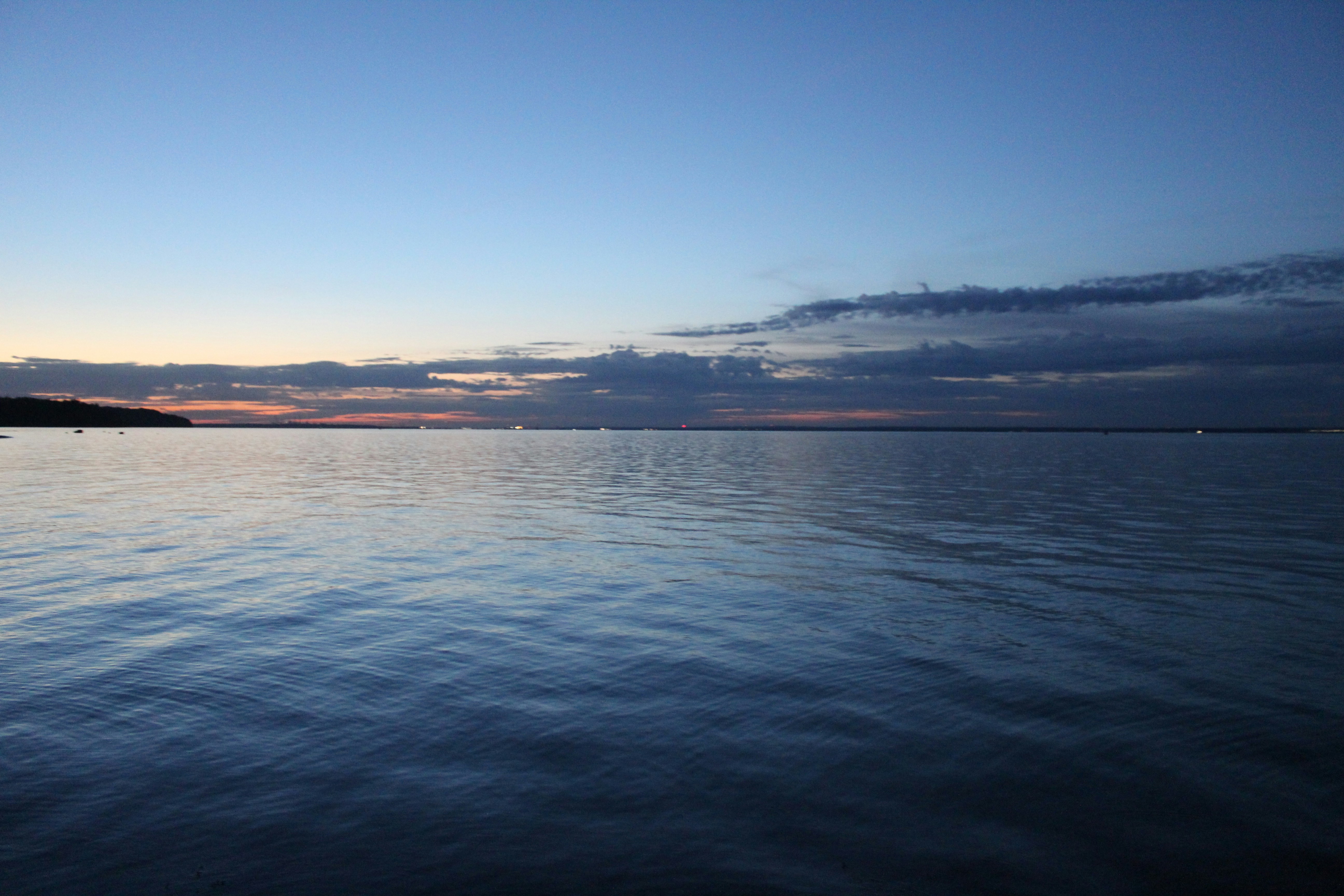 Dusk over a Calm Ocean: A Horizon Line Soothing the Sky