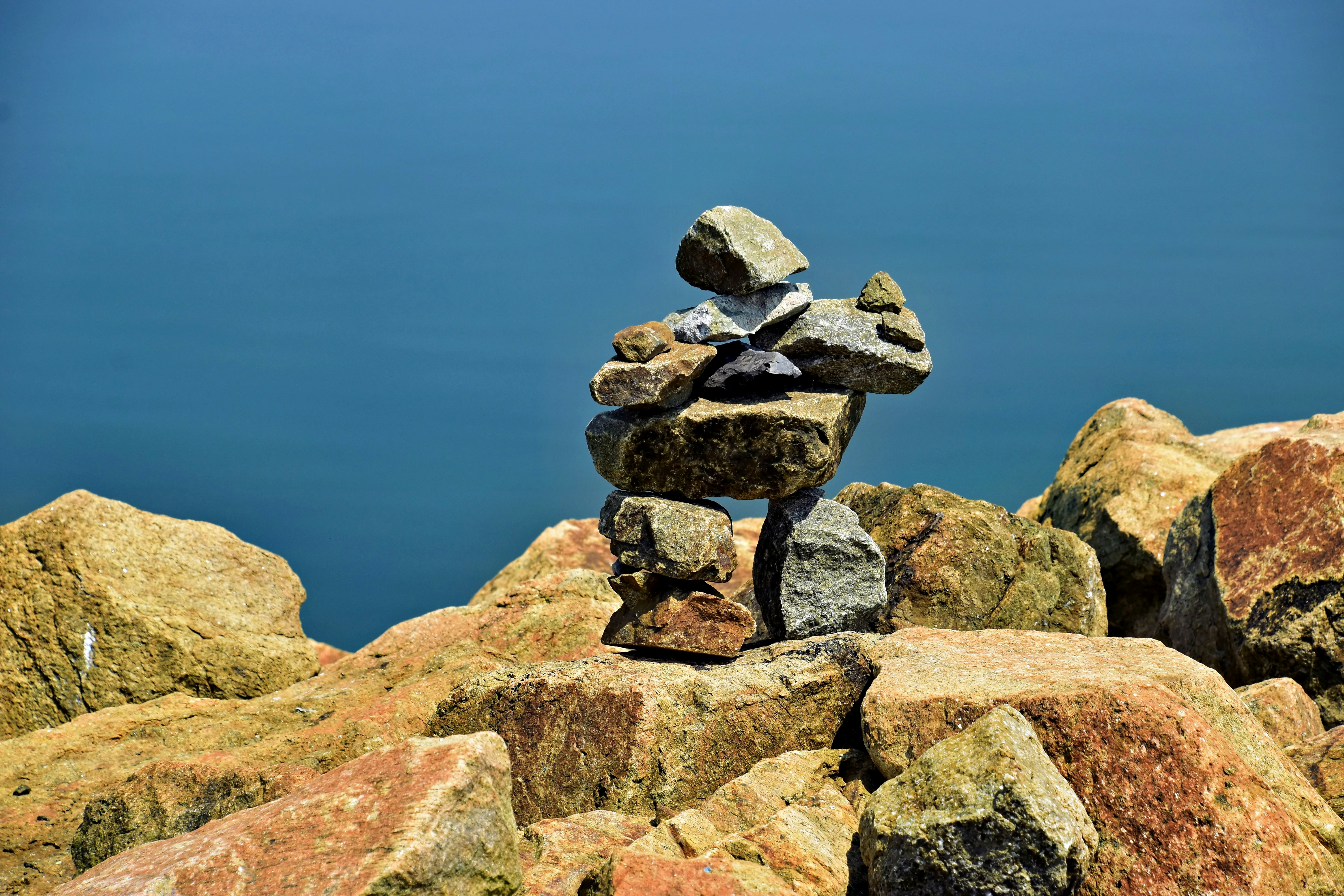 Stone Balance at the Edge of Quiet Blue