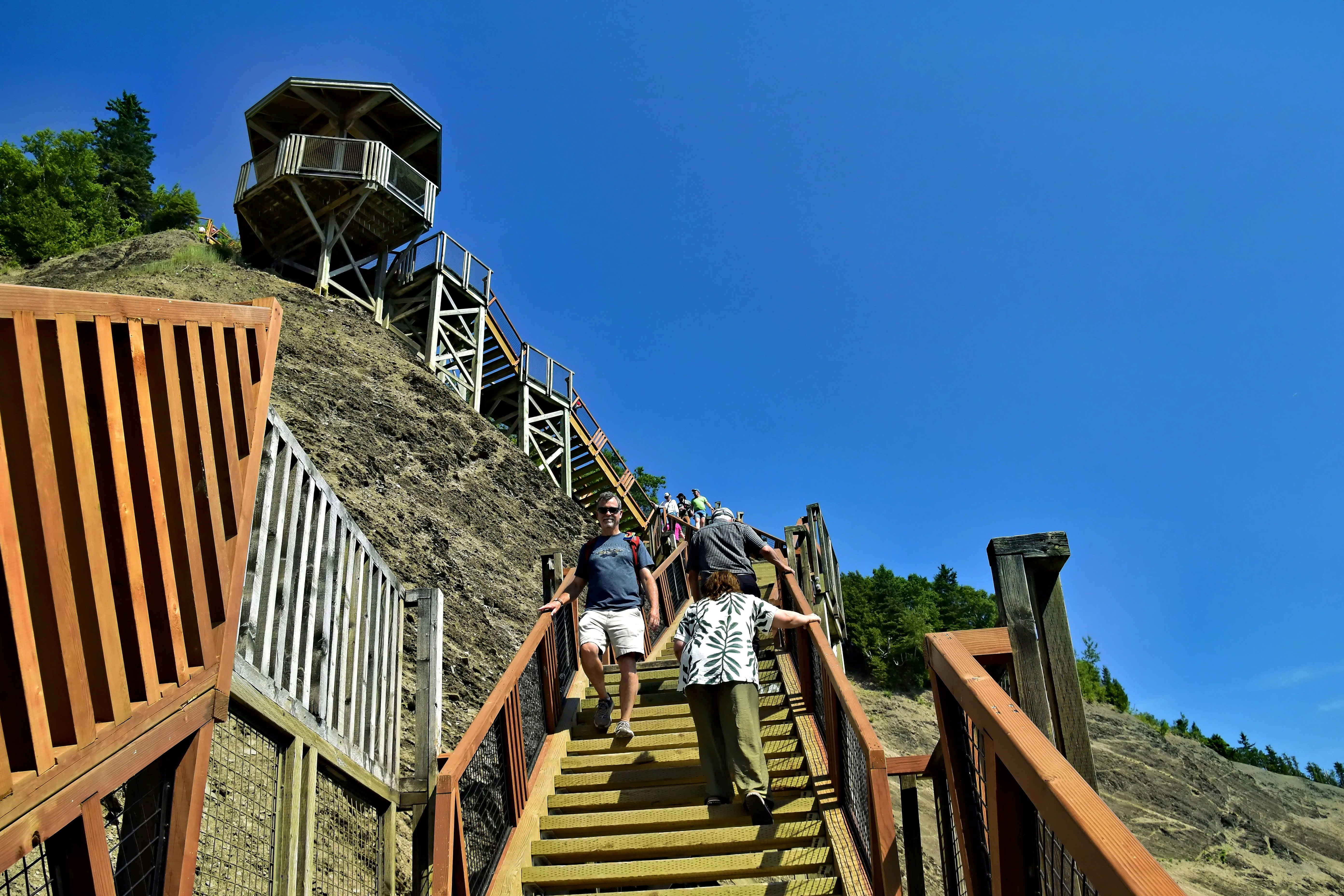 Climb Up to the Lookout: Stairs, Steel Rails, and a Bright Sky