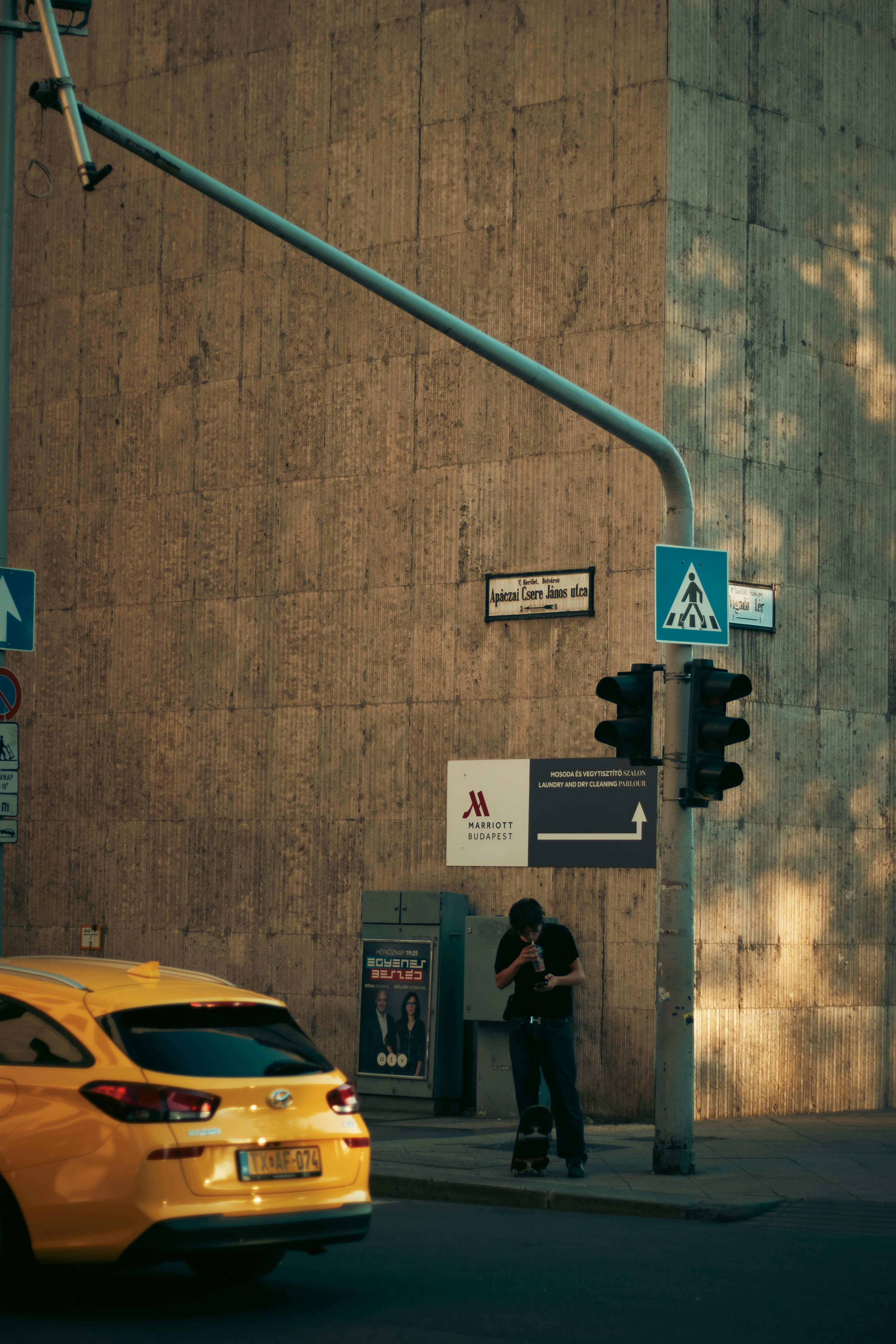 Neon-Tinted Street Corner: Taxi, Signage, and a Quiet Moment under Urban Light