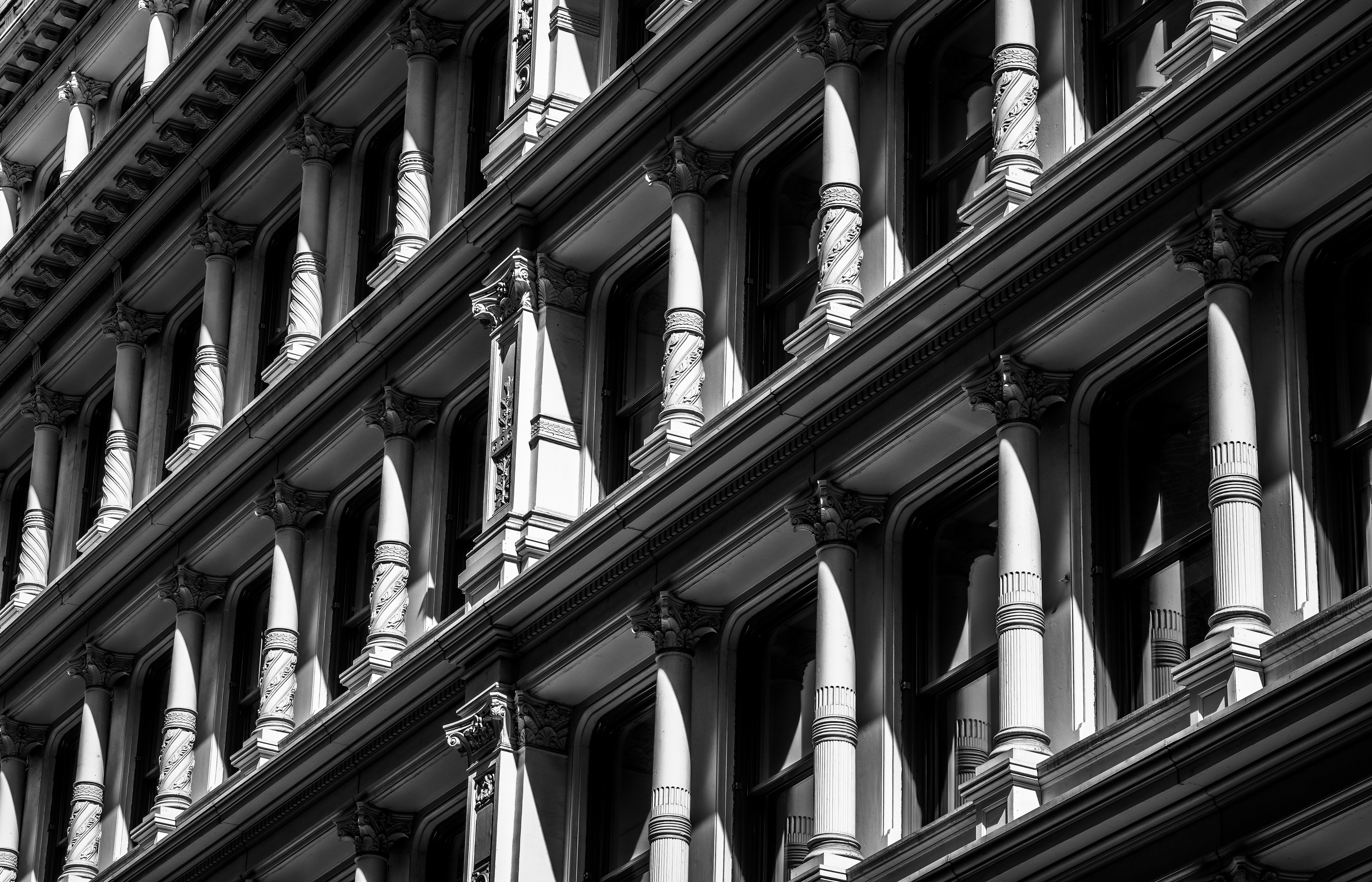 Ornate Facade Echoes: Repeating Spires in Monochrome