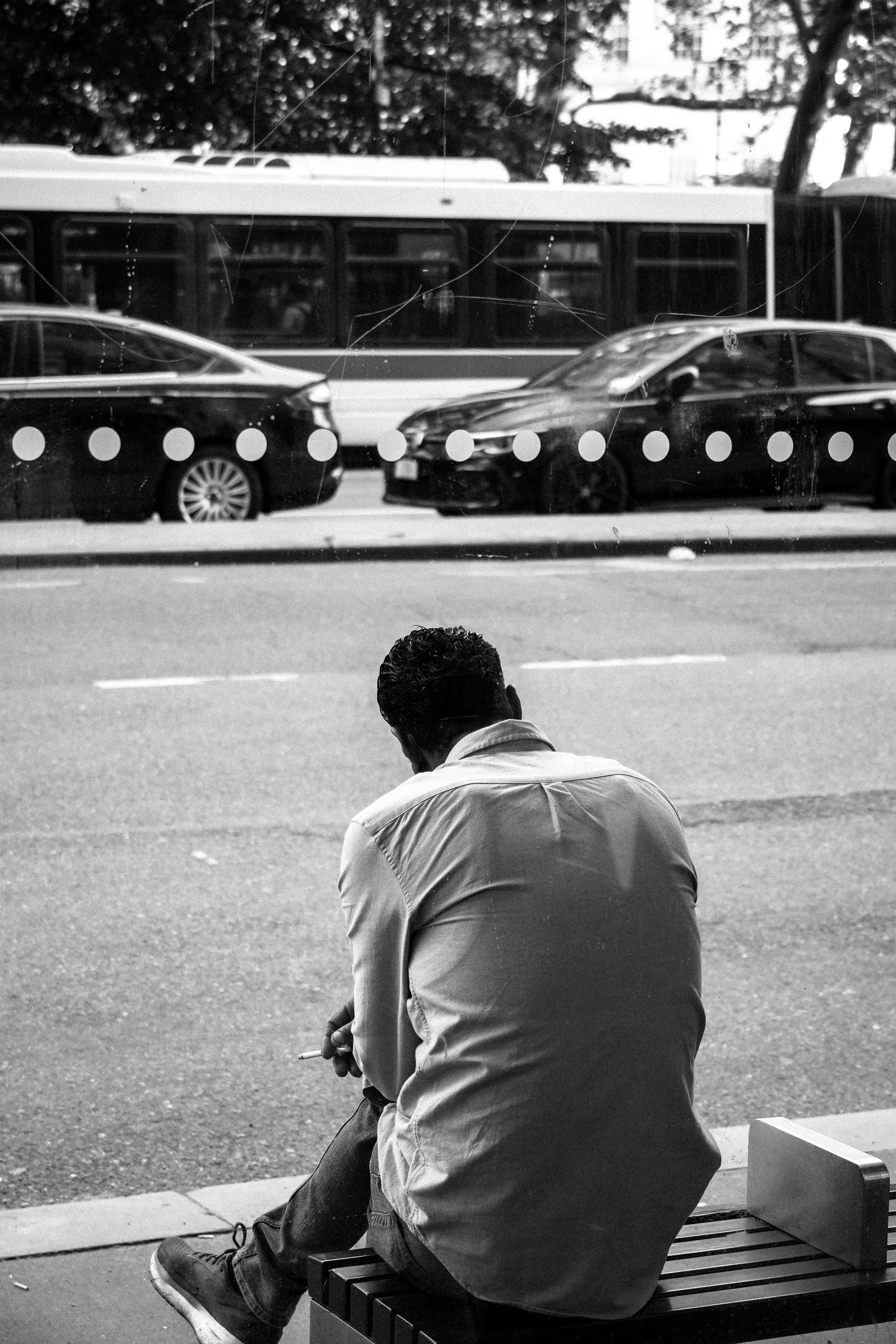 After the Stop: A Quiet Moment on a Bus-Choked Street
