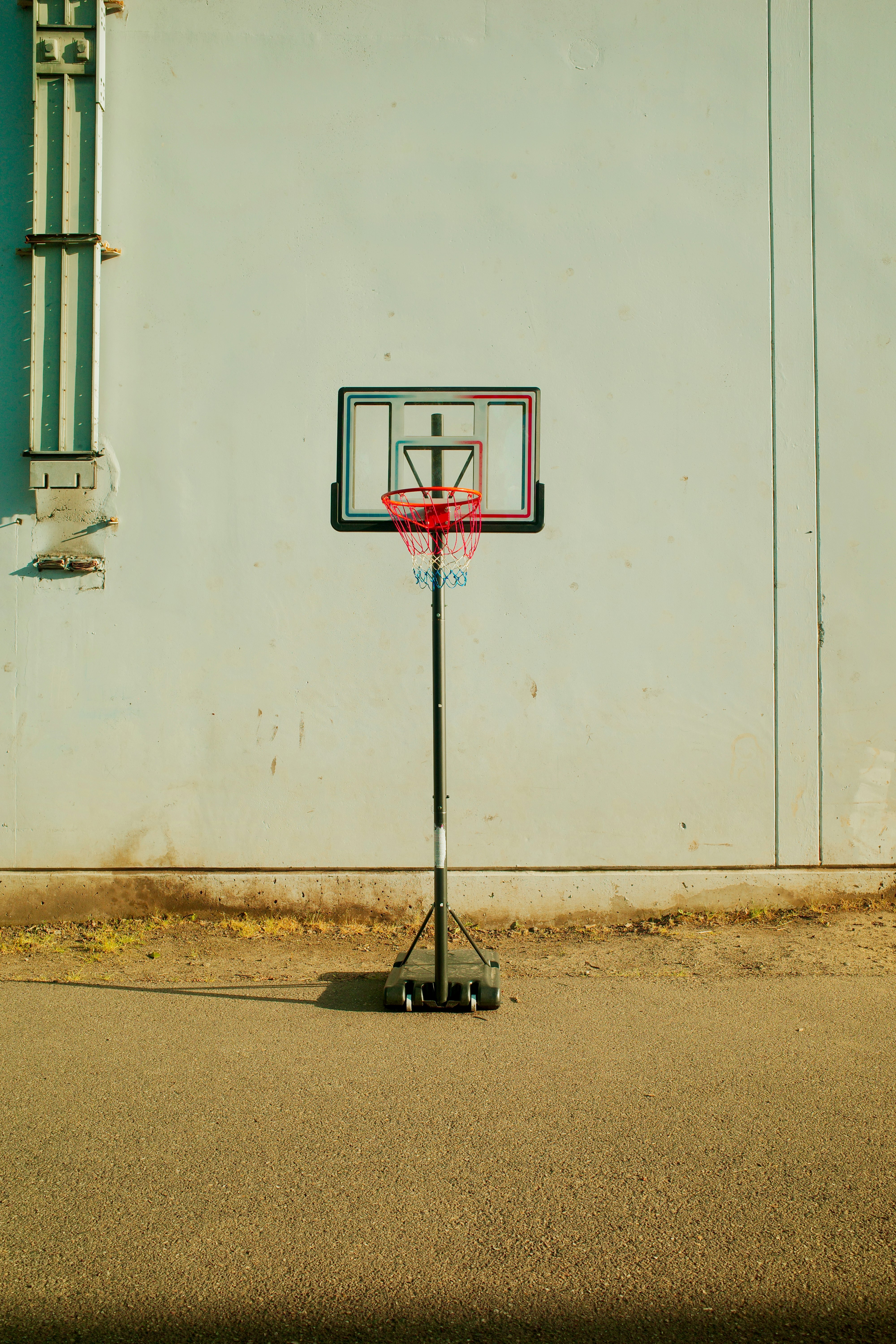Standalone Outdoor Basketball Hoop on Empty Court