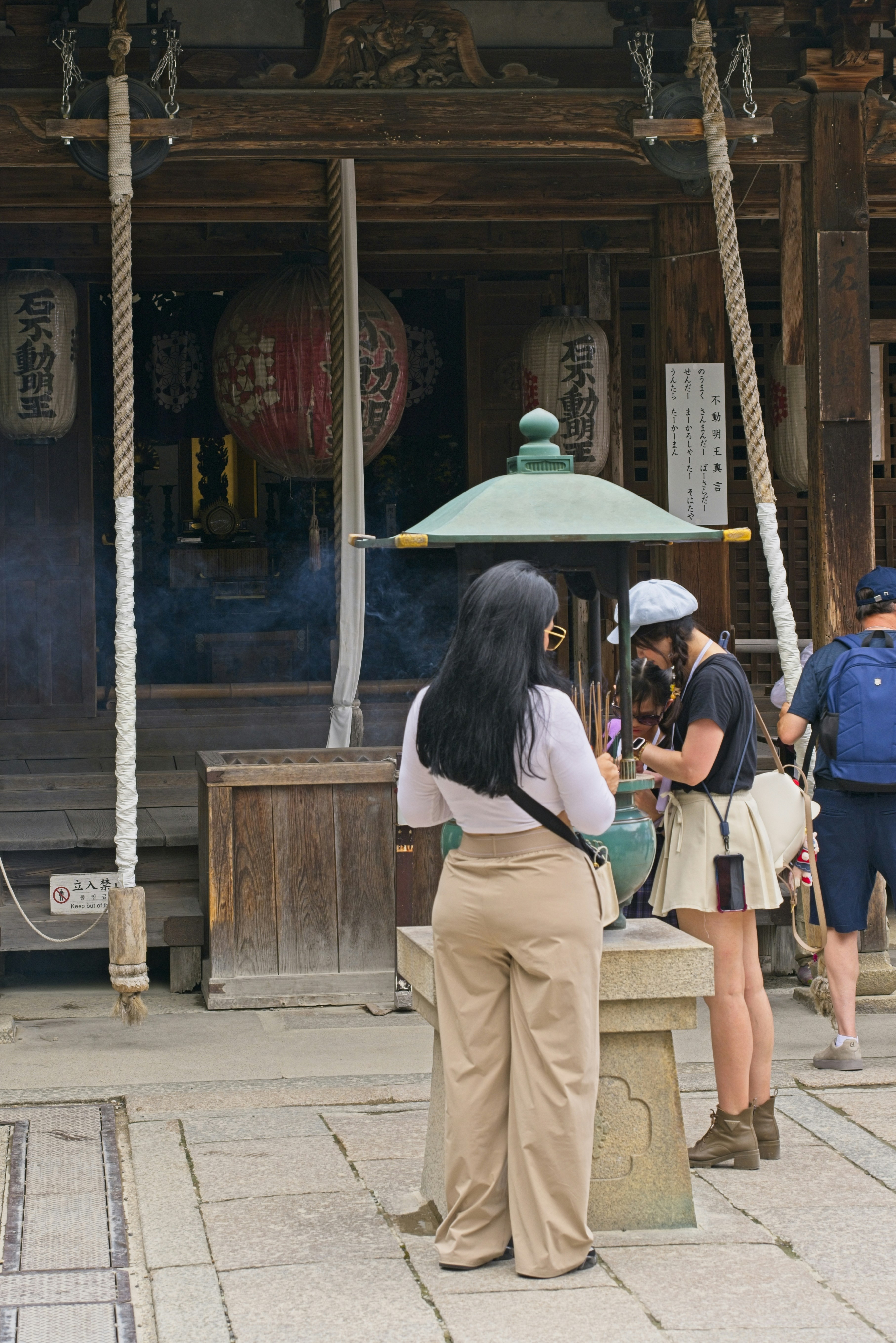Temple Visitors at a Shrouded Shrine Pooling Under a Green Lantern