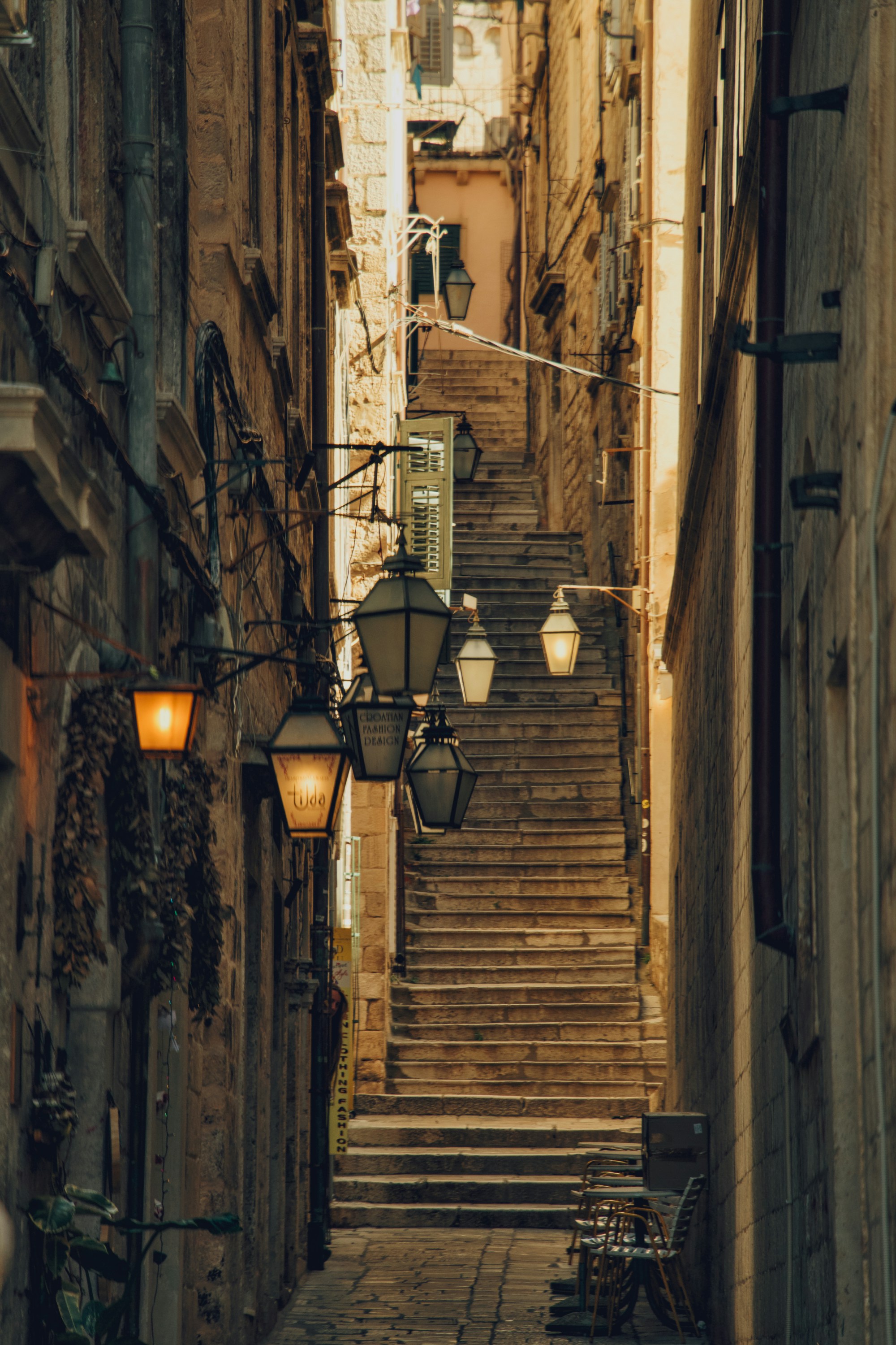 Silent Staircase Through a Sunlit Alley