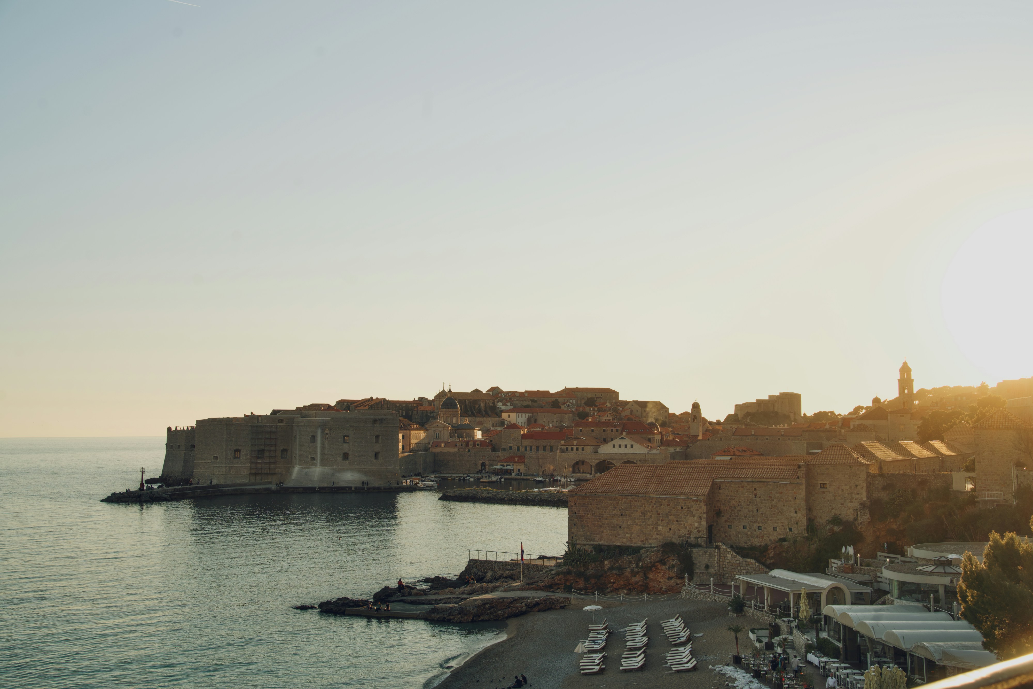 Sunlit Citadel Overlooking a Quiet Harbor