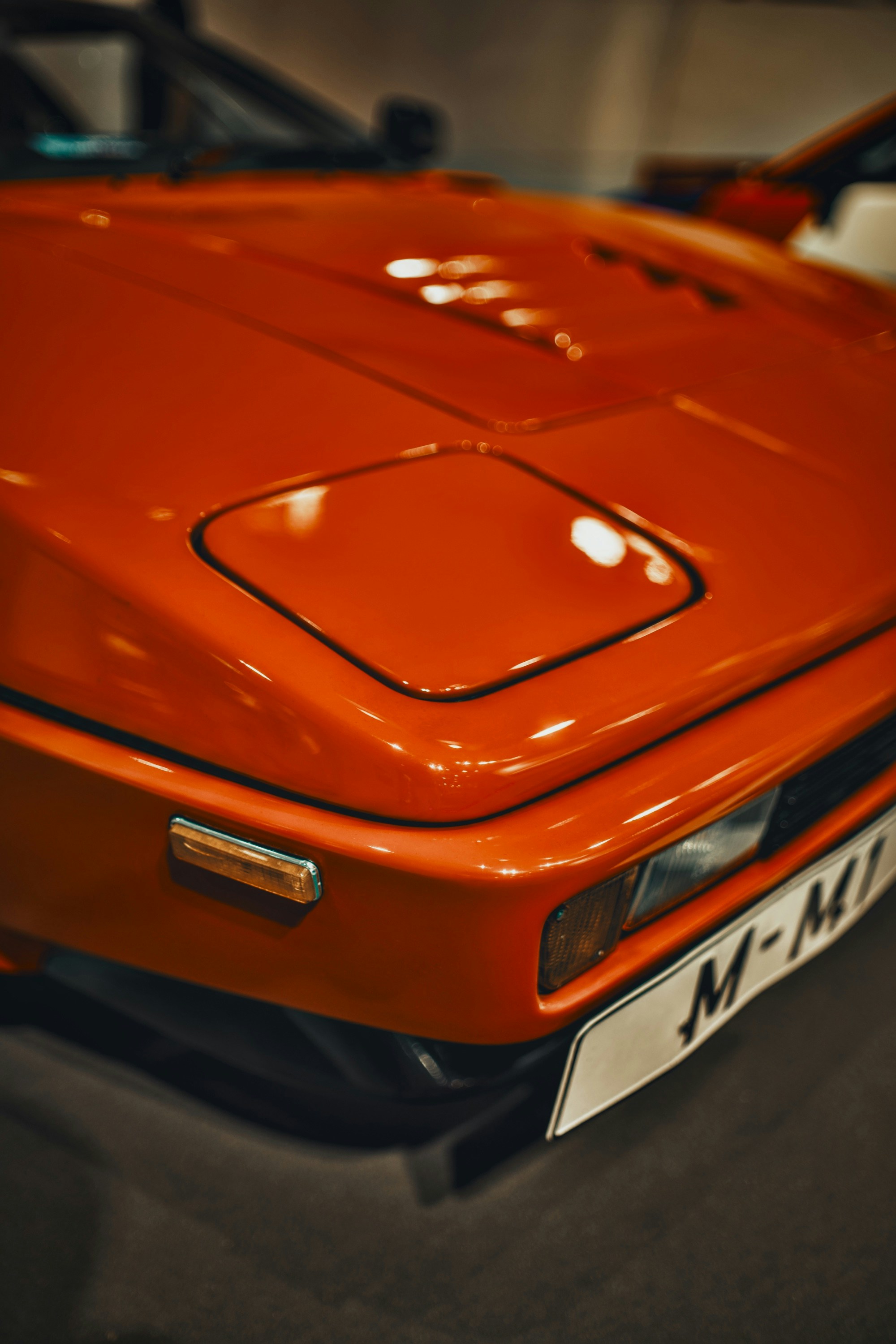 Crimson Curves: The Hood of a Classic Fire-Red Icon