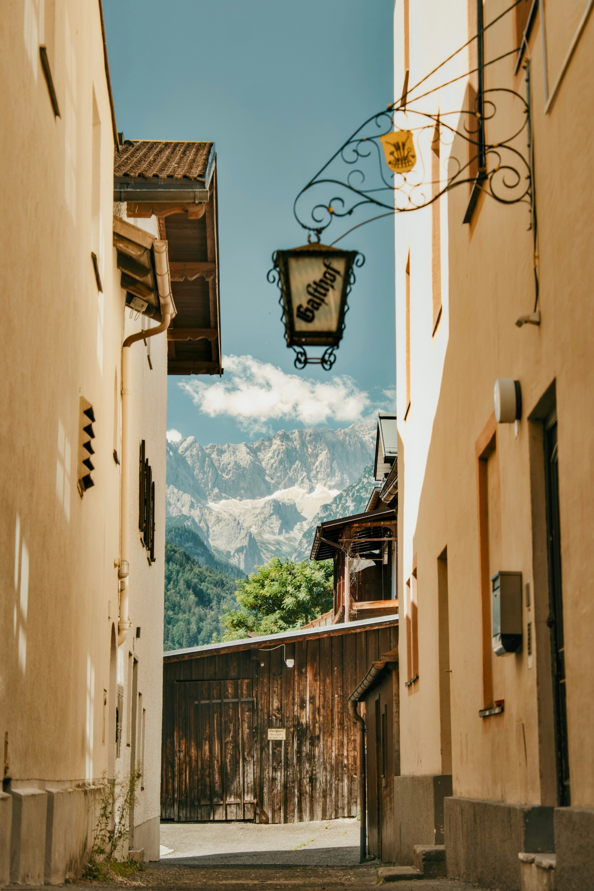 Alpine Alleyway Under Lantern Signage
