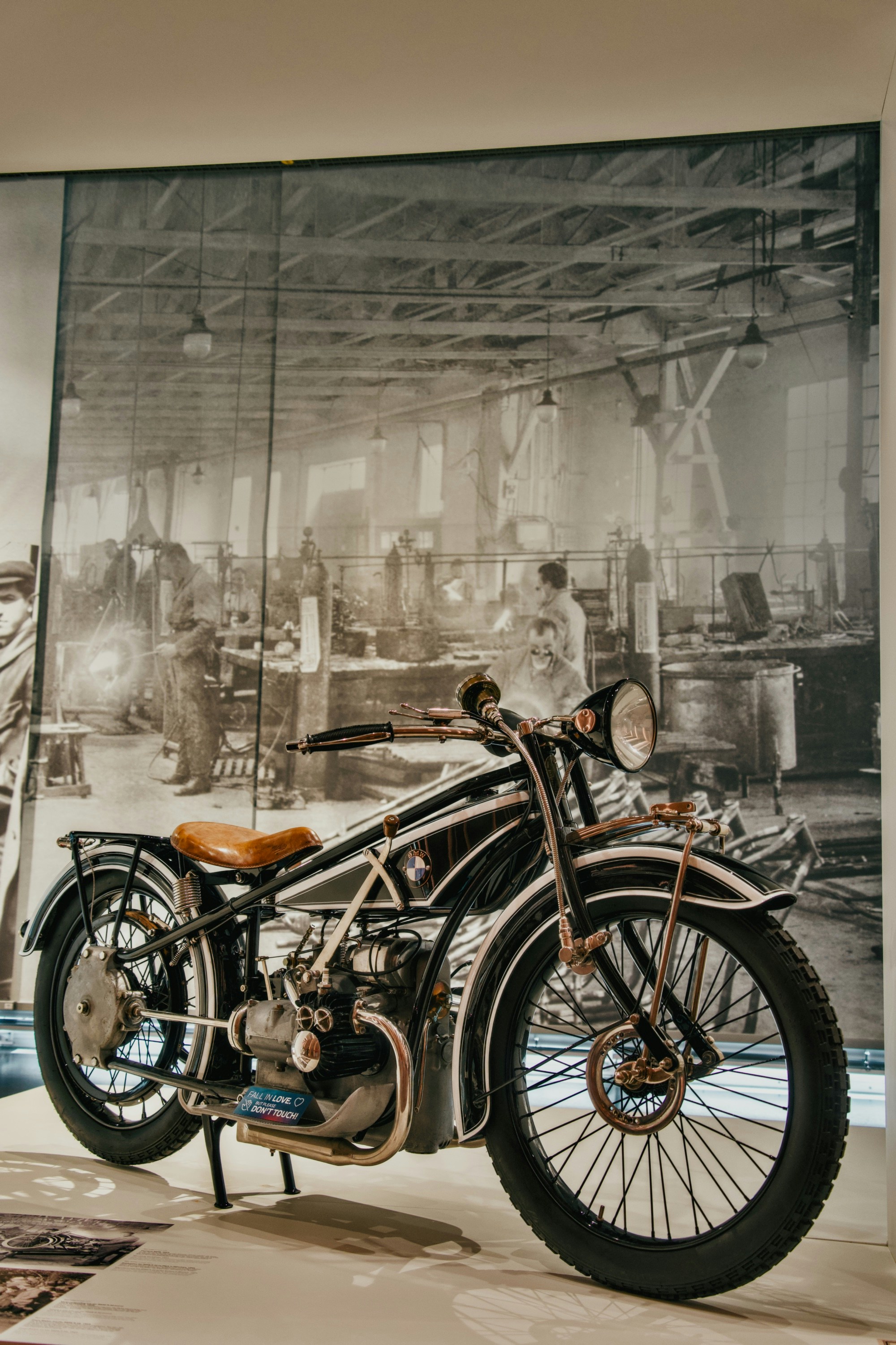Vintage motorcycle on display within a museum diorama