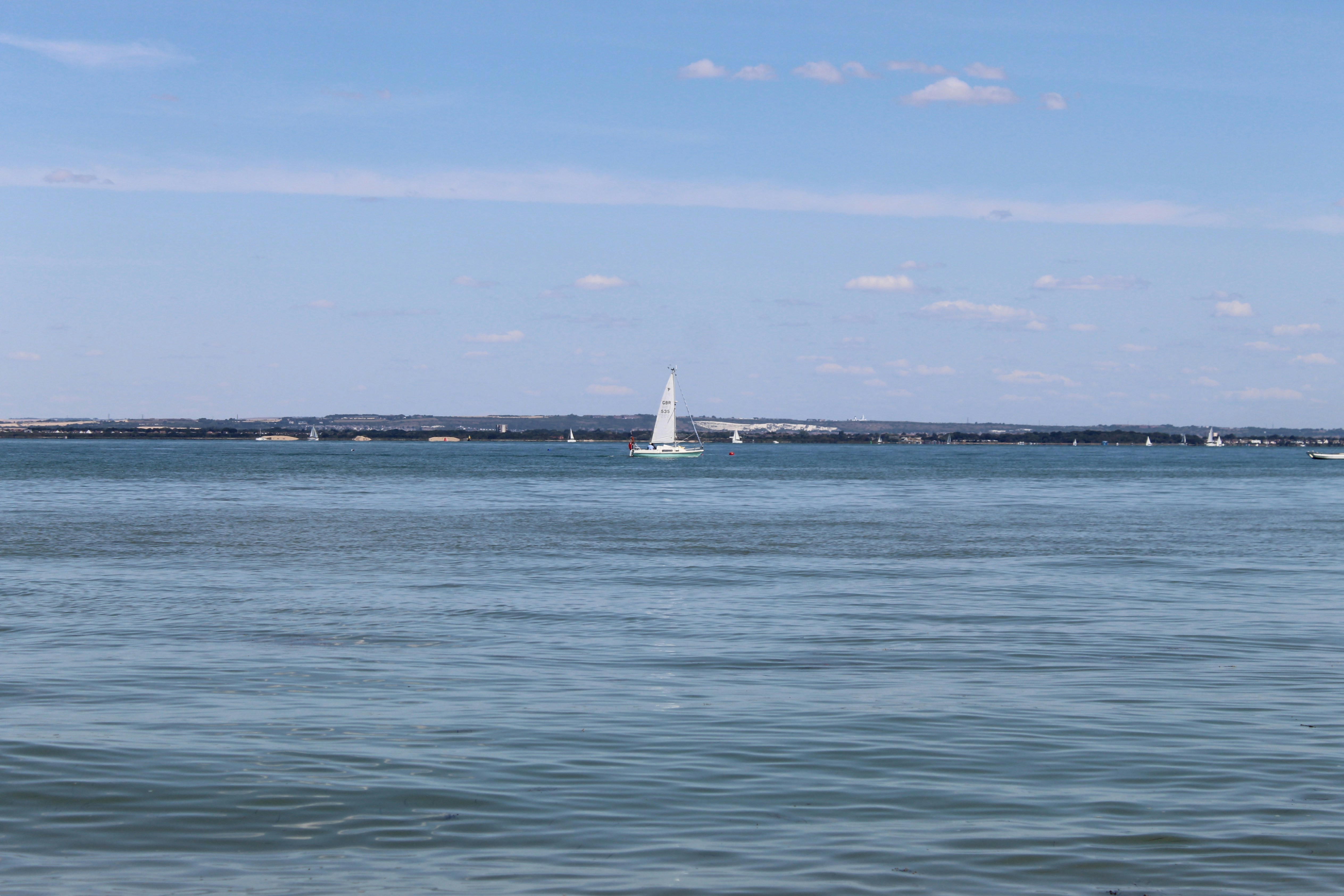 Sailboat on a Calm Sea at Midday