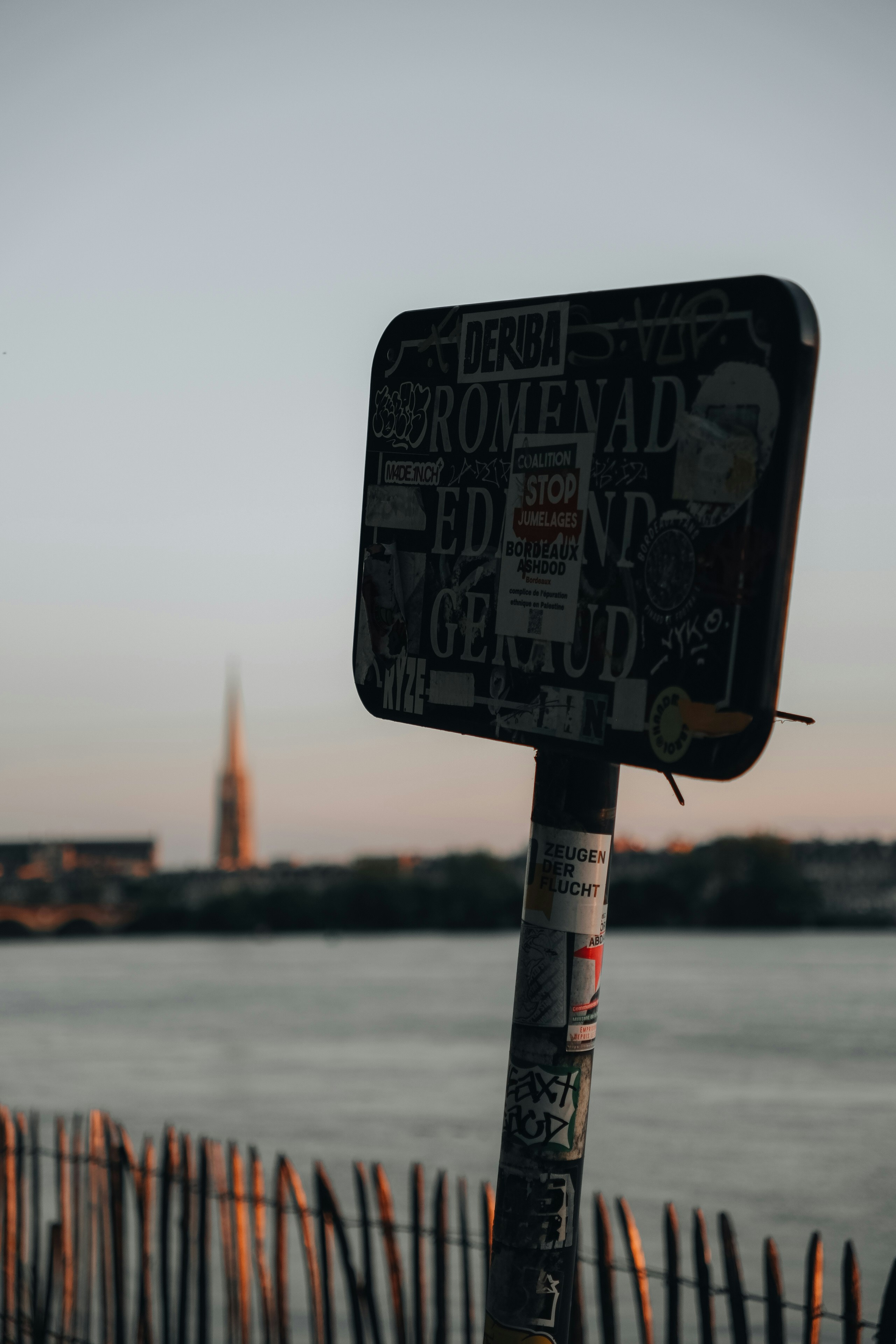 Signpost by the River at Dusk