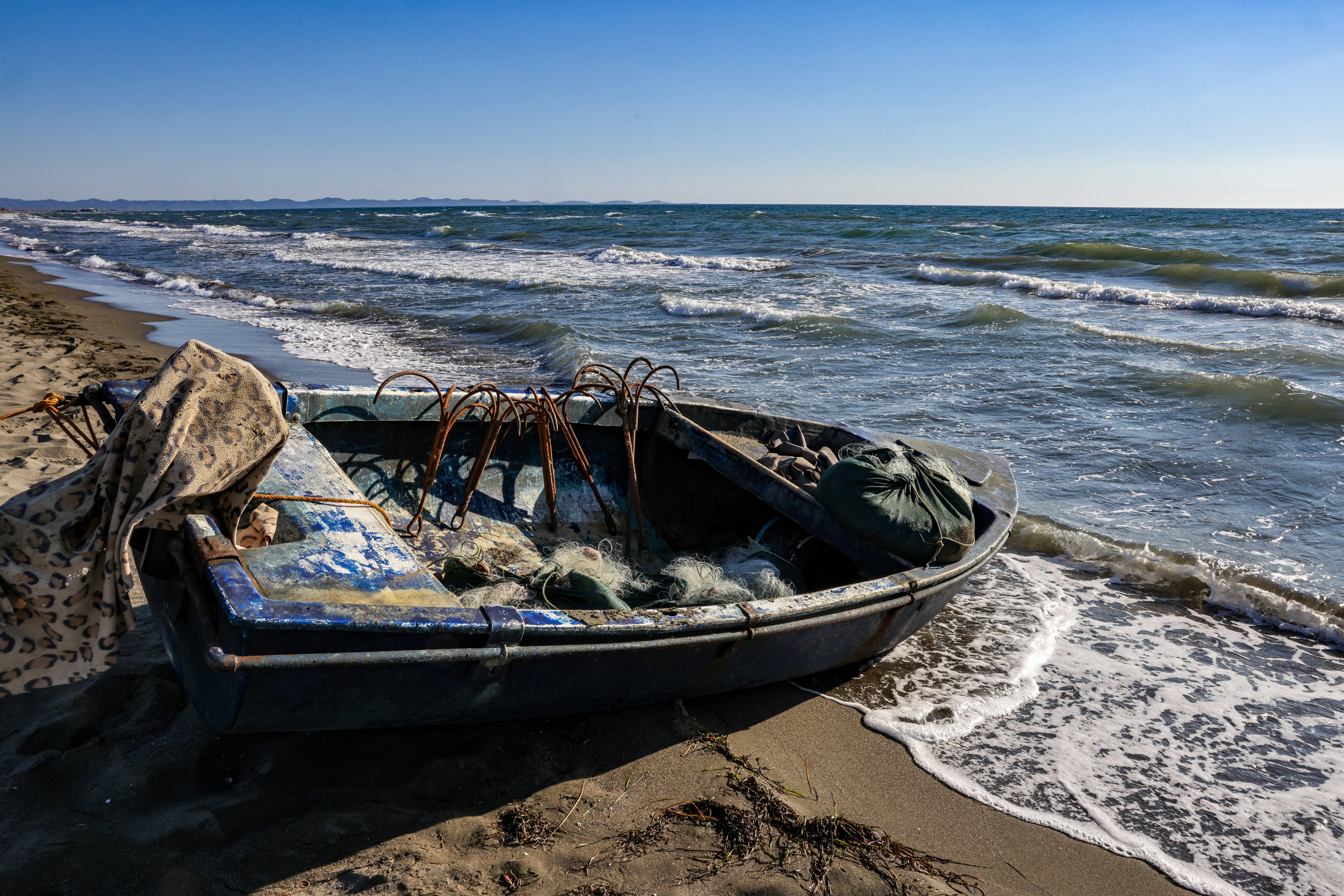 Afterglow for the Shore: A Weathered Boat on a Quiet Beach