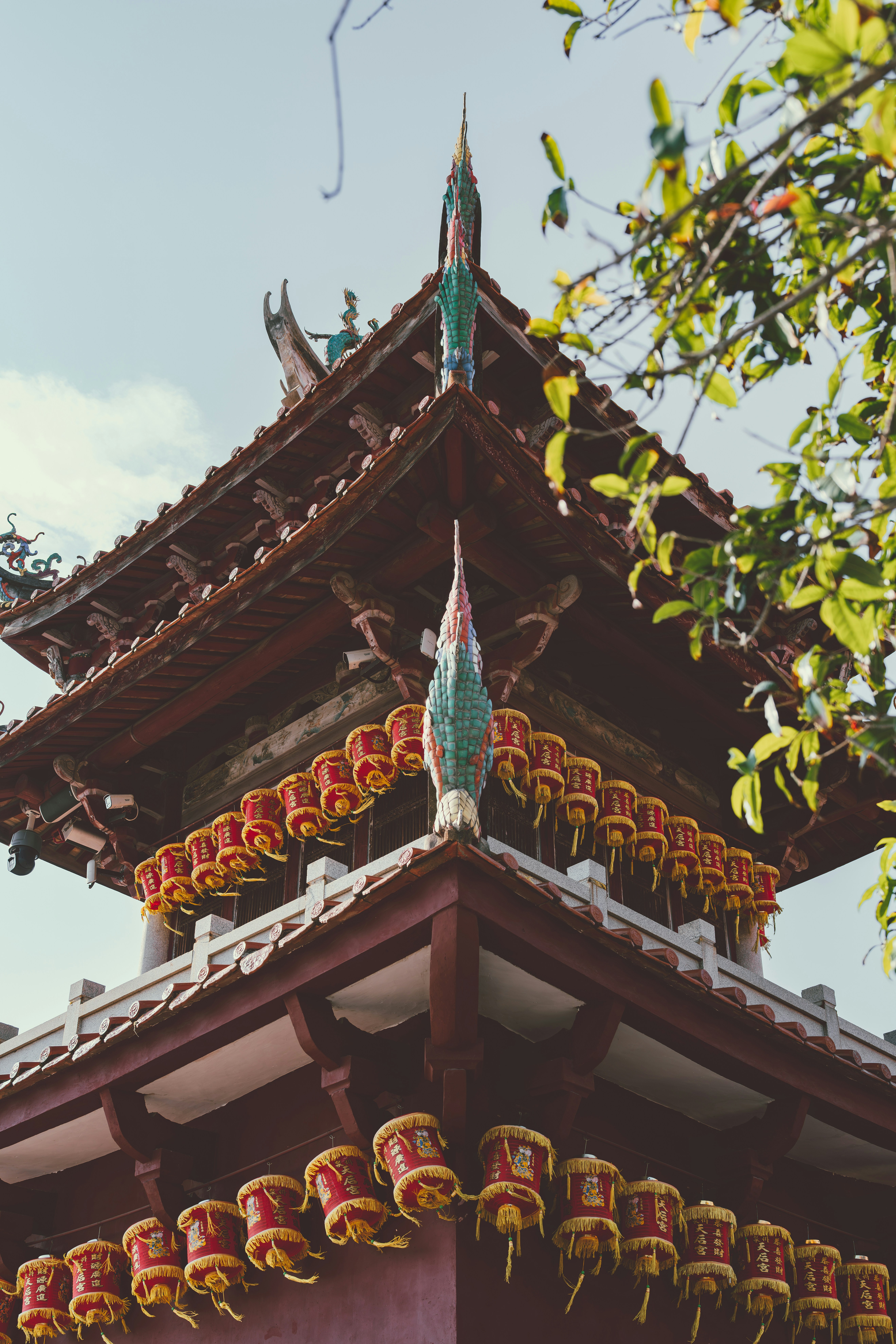 Pagoda Aglow: Lanterns and Eaves in a Sunlit Chinese Temple