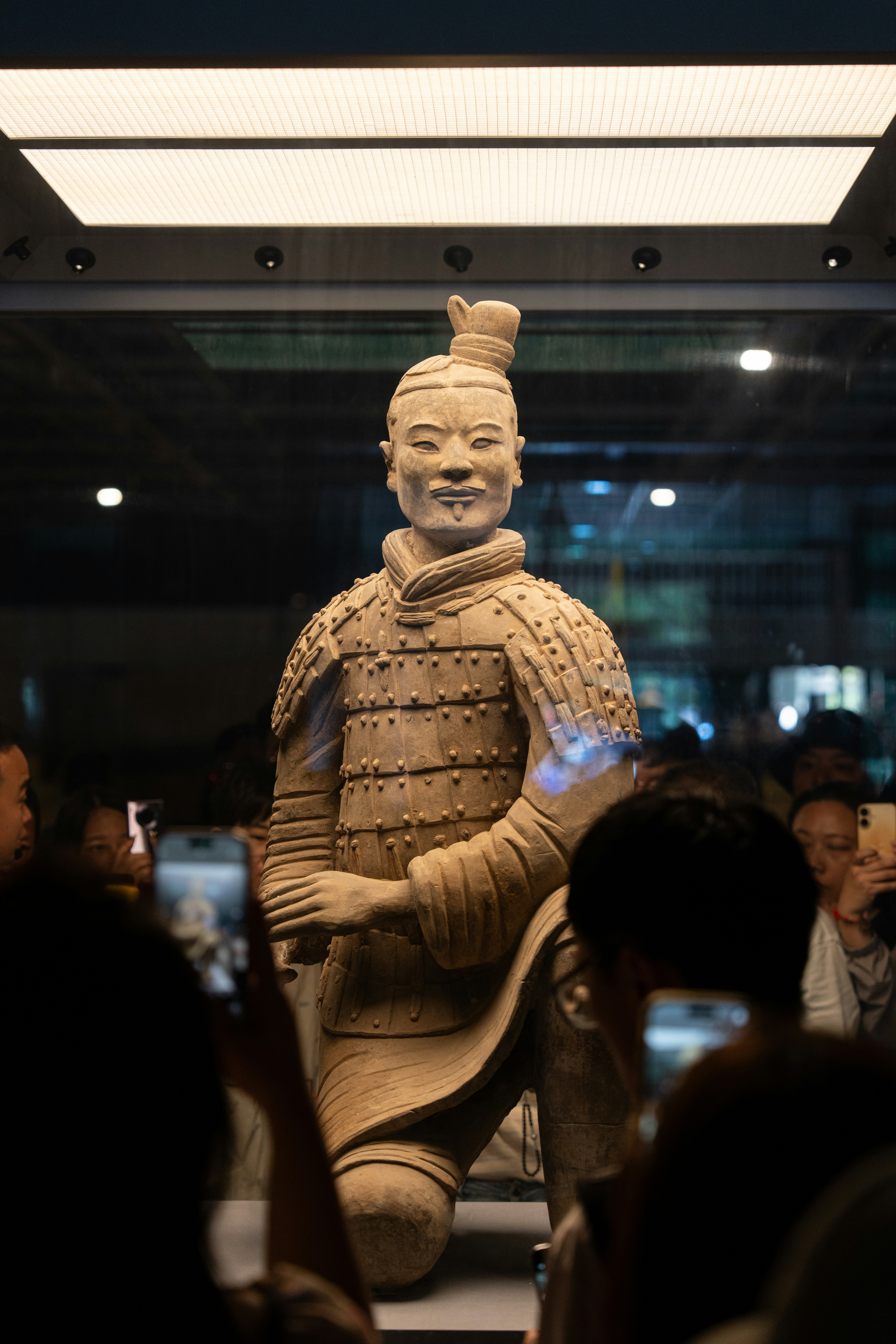 Gladiator in the Glass: Terracotta Warrior Surrounded by a Sea of Phones