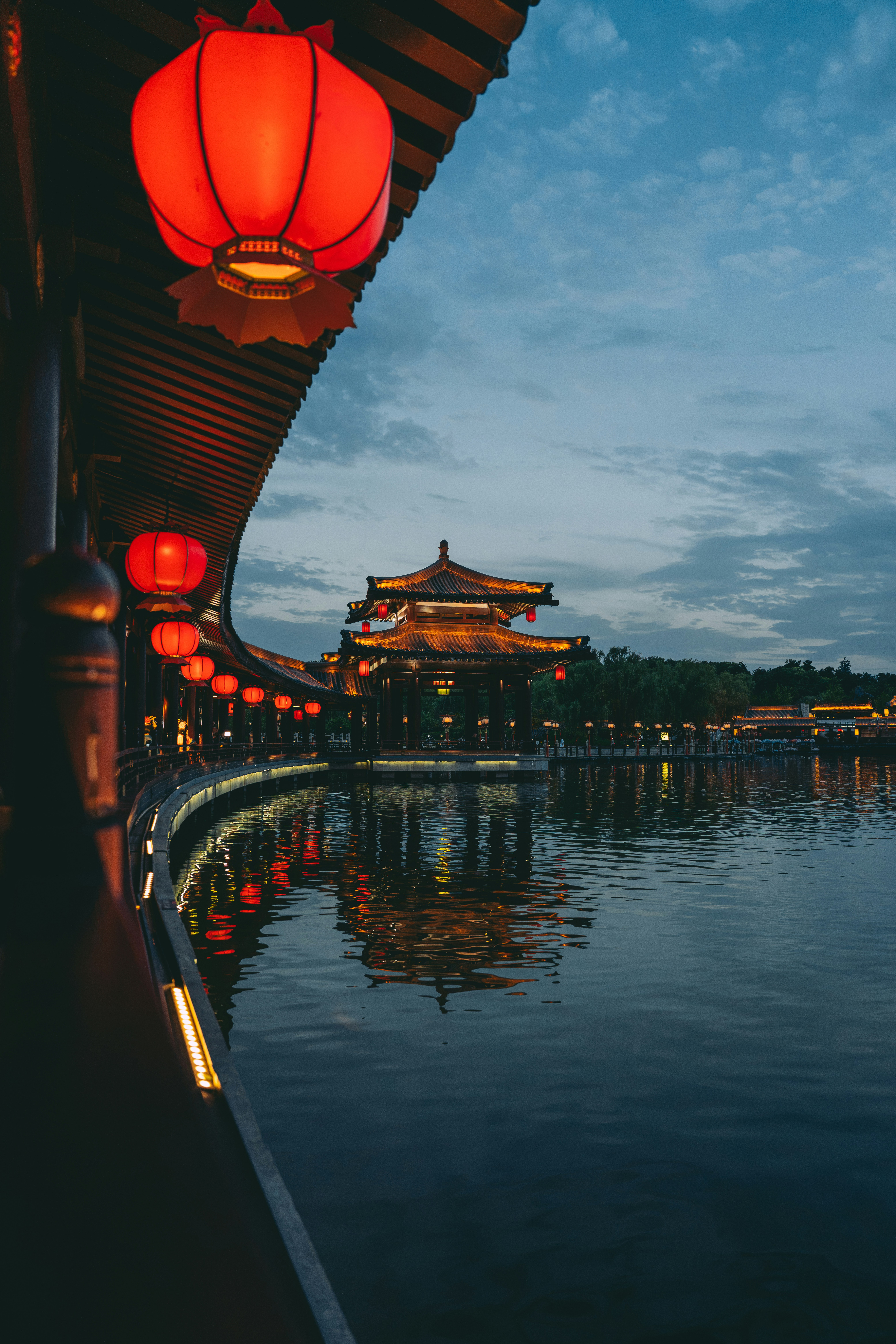 Red Lanterns Over still waters at twilight Shanghai-style riverside