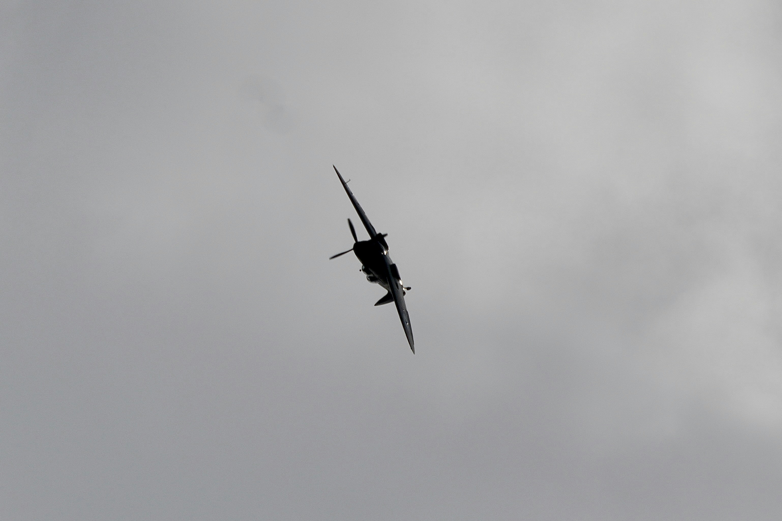 Assertive Jet Slice: A lone fighter etches through overcast light
