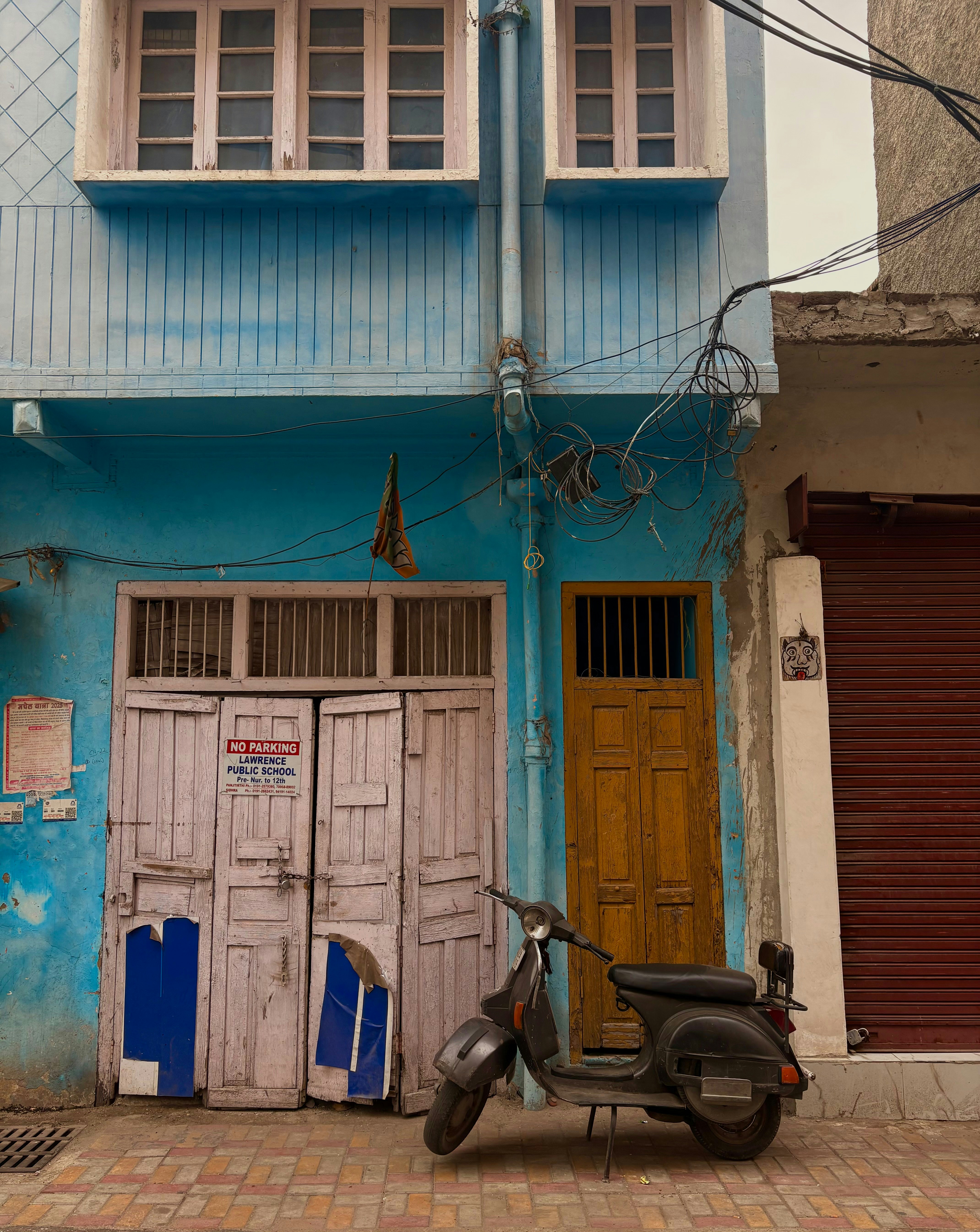 Blue Facade, Yellow Door, and a Quiet Scooter