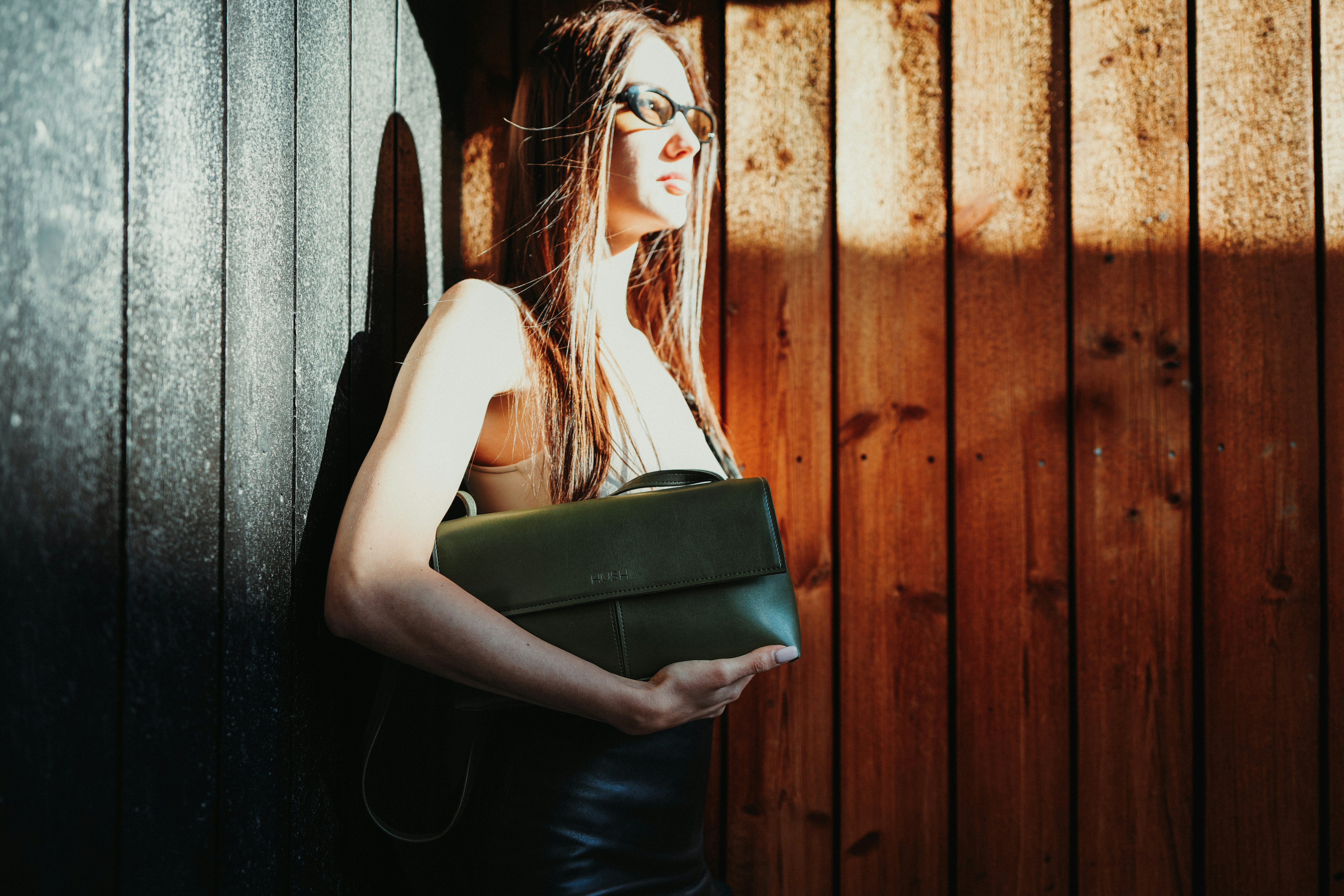 Shadowed Chic: A Bold Portrait with Urban Warmth