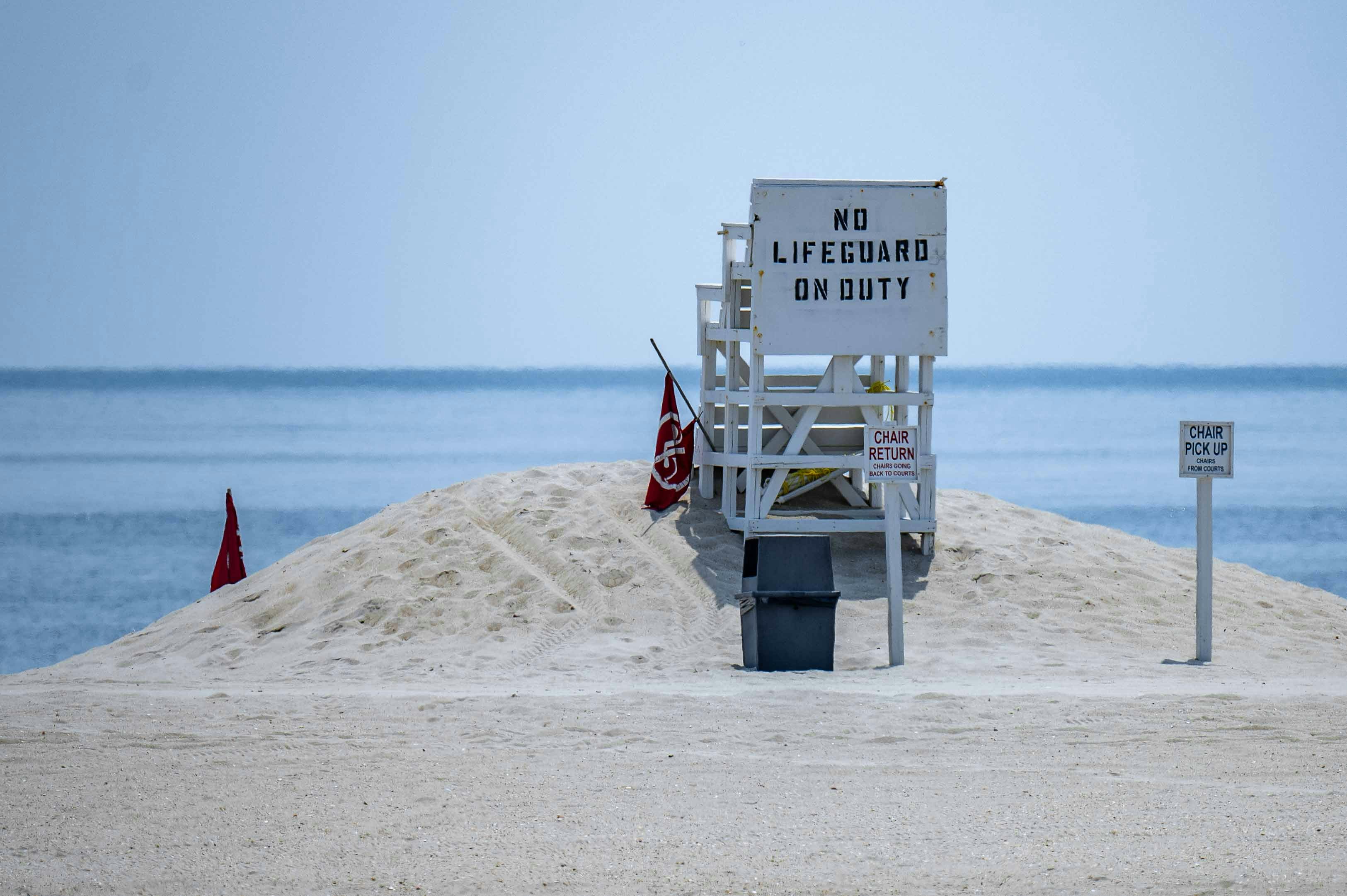 Lifeguard Stand on Quiet Sandbar Reaching Toward the Sea