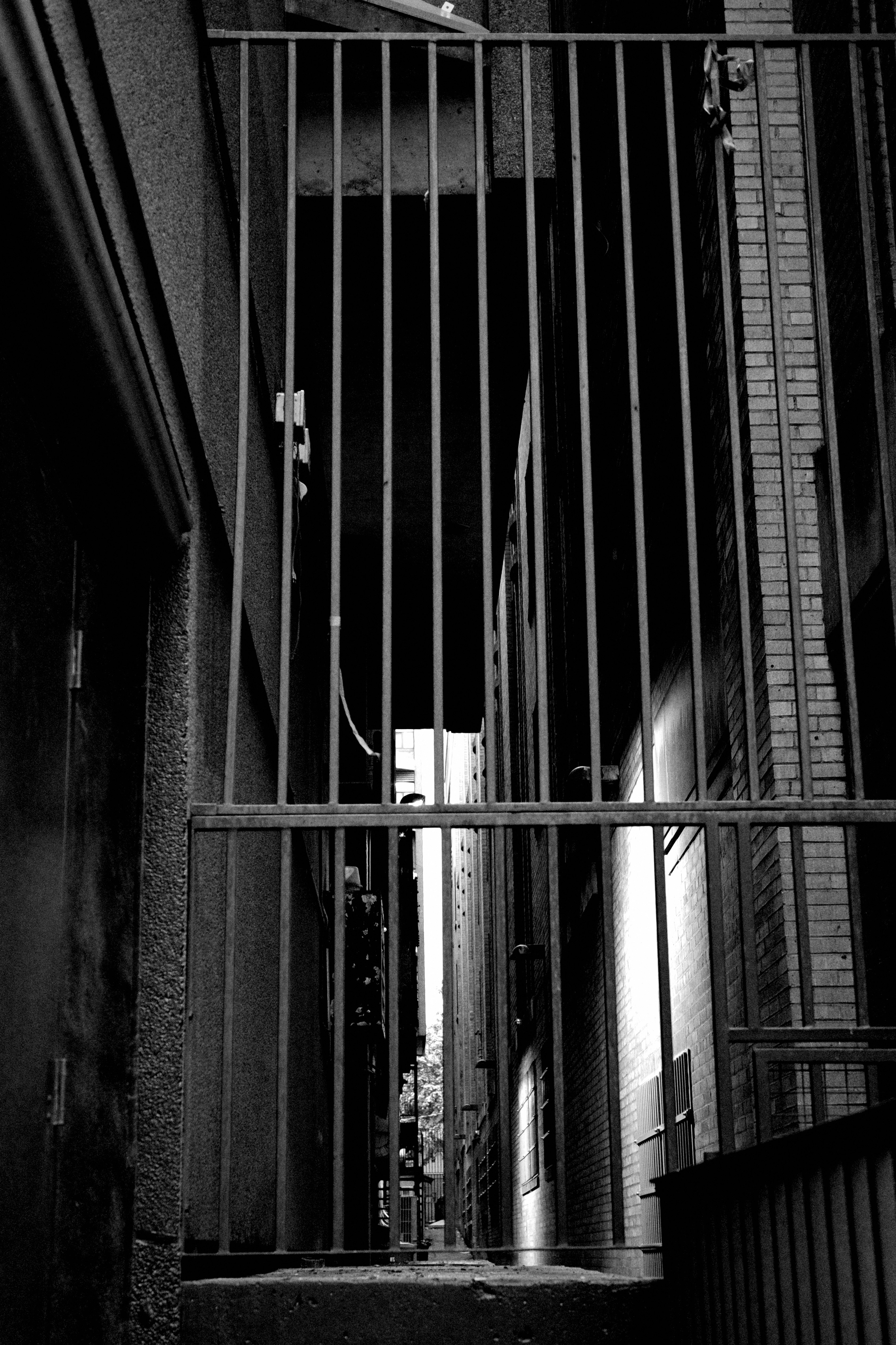Shadowbound Alley: vertical bars and narrow light