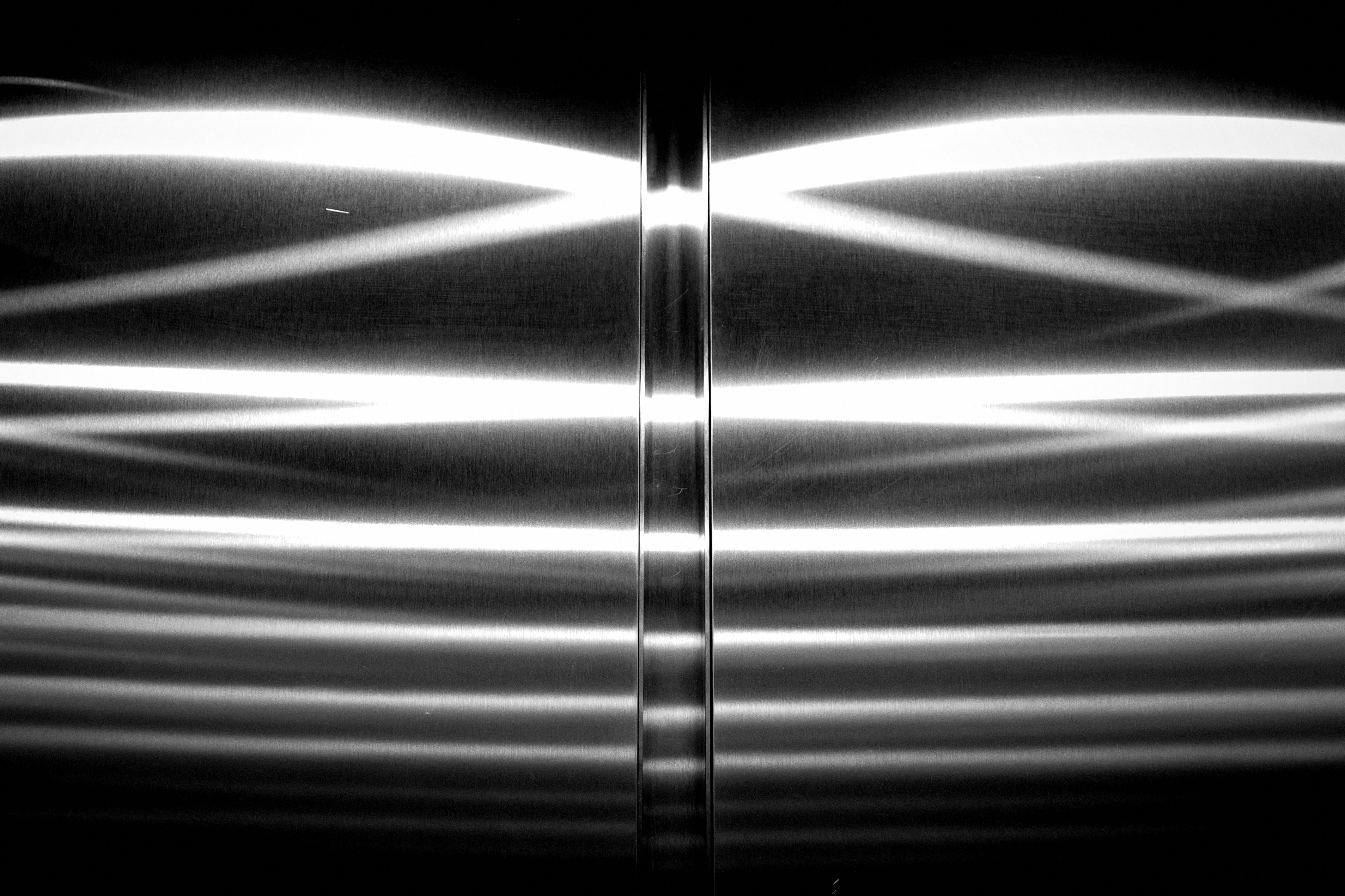 Symmetry in Steel: Reflections Across a Narrow Threshold
