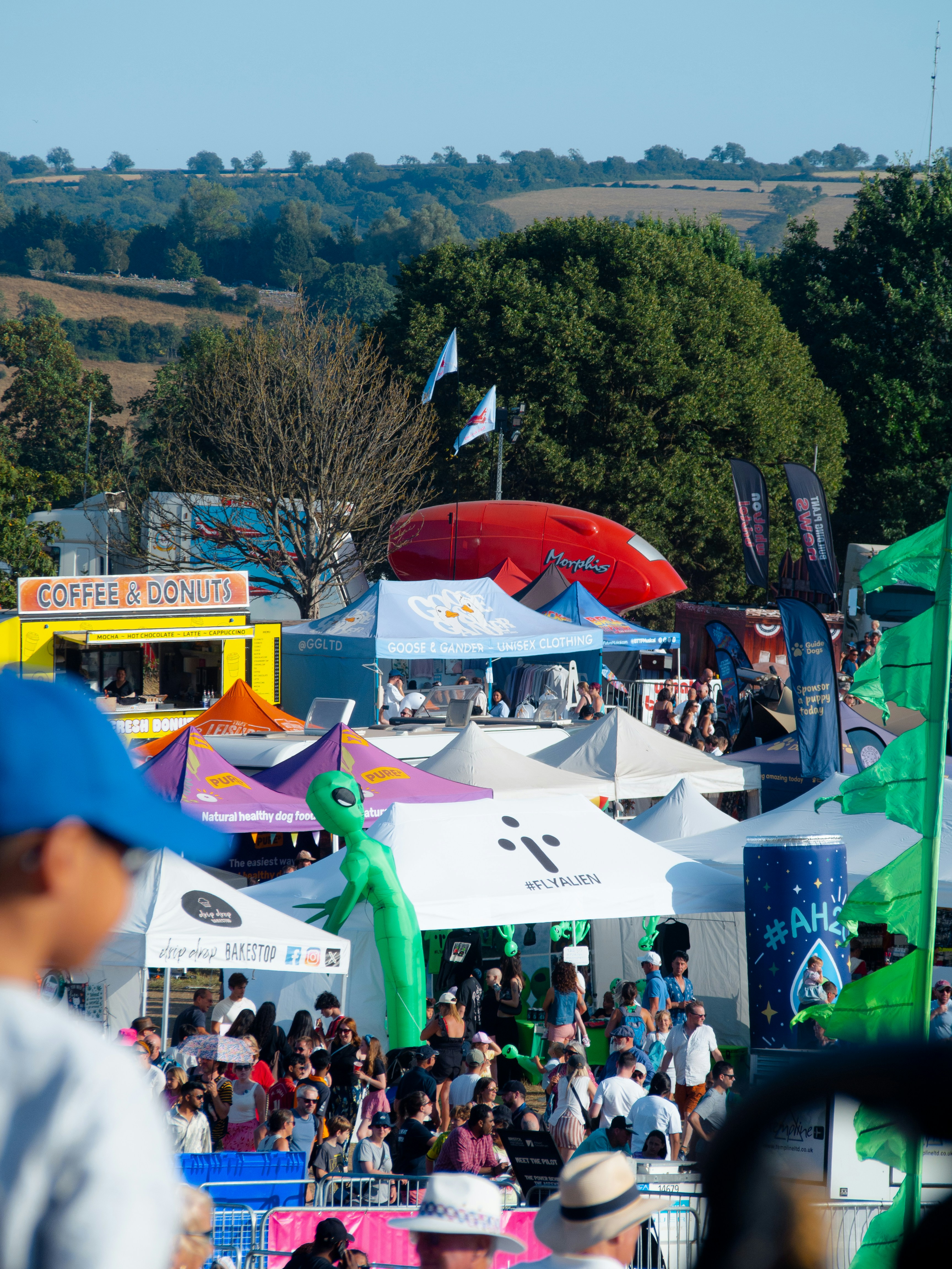 Festival Market Pulse: Tents, Flags, and Energy in a Summer Arcade
