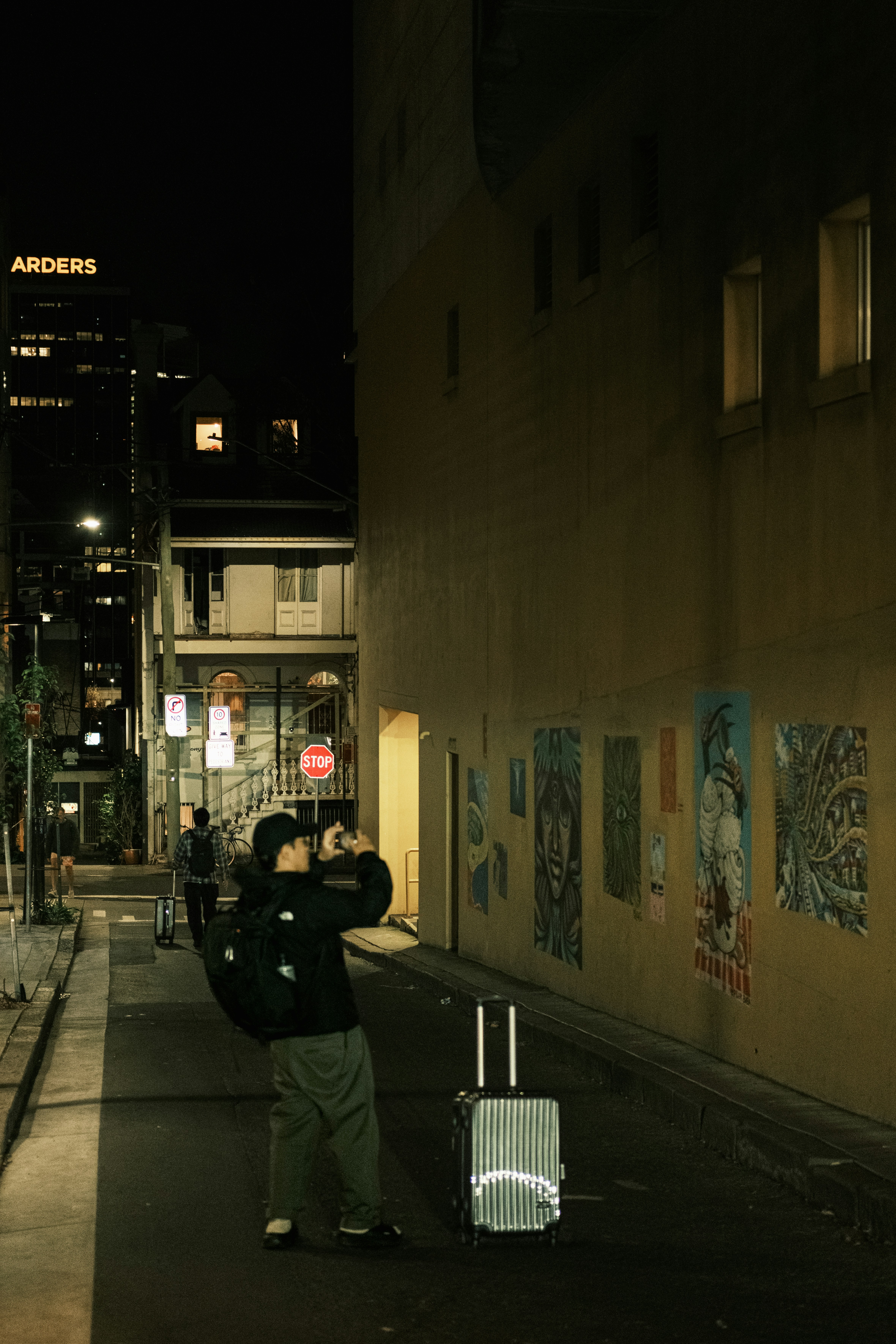 Nightbound Shuffle: Traveler Pays a Quiet Farewell to the City