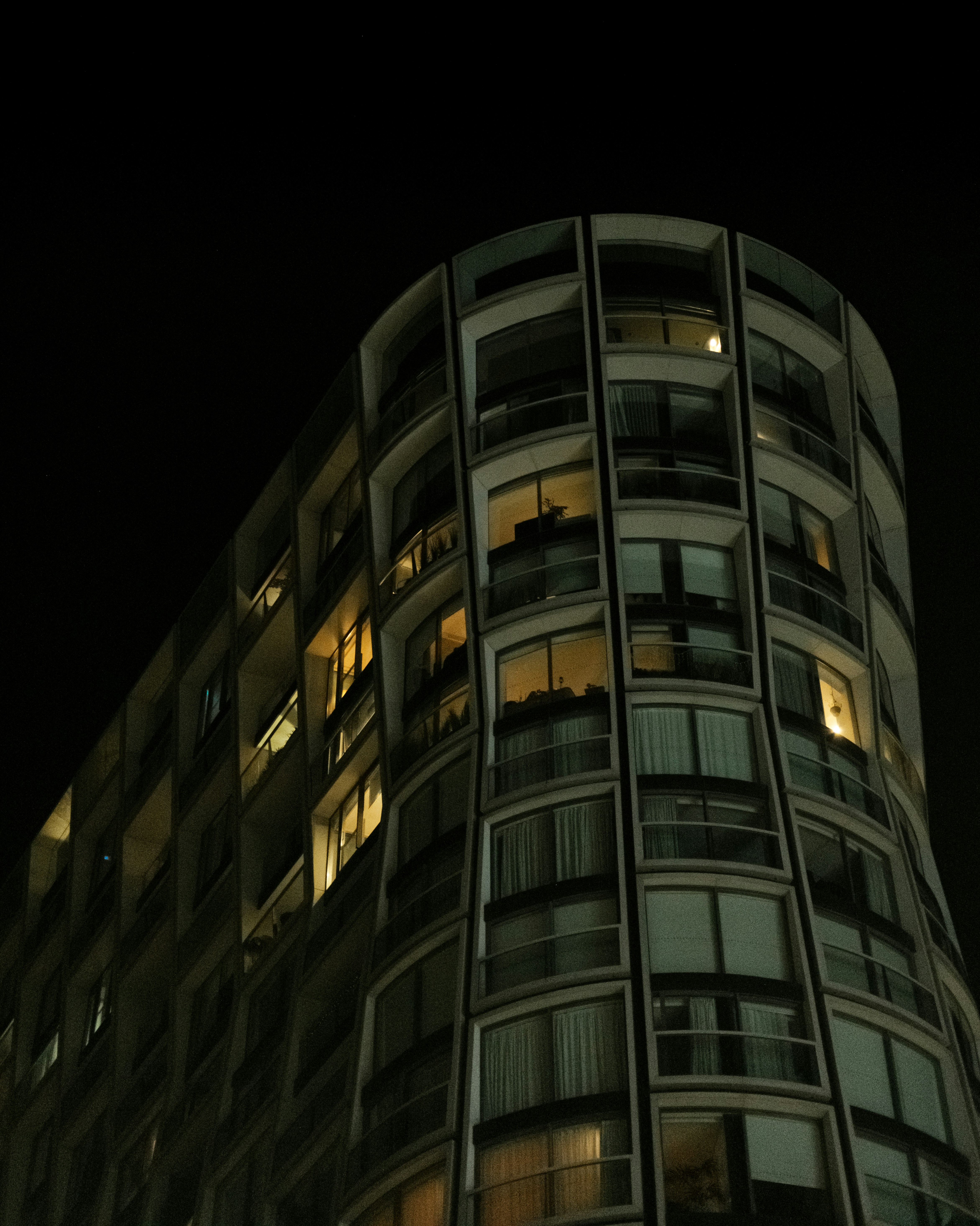 Nighttime Curves: An Apartment Tower Glows in Silence