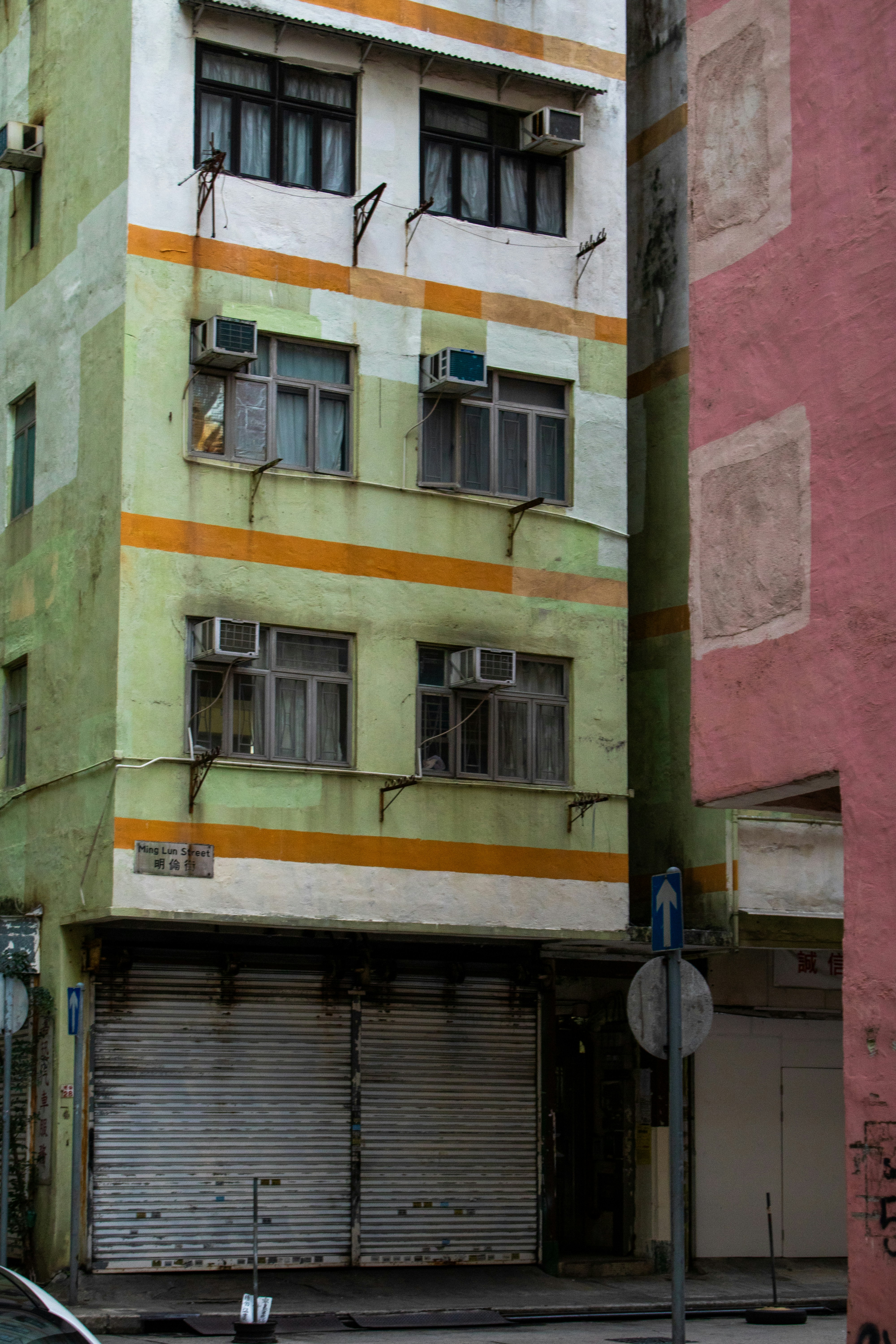 Pastel Facade Portrait: Stripes, Shutters, and Shutter Doors
