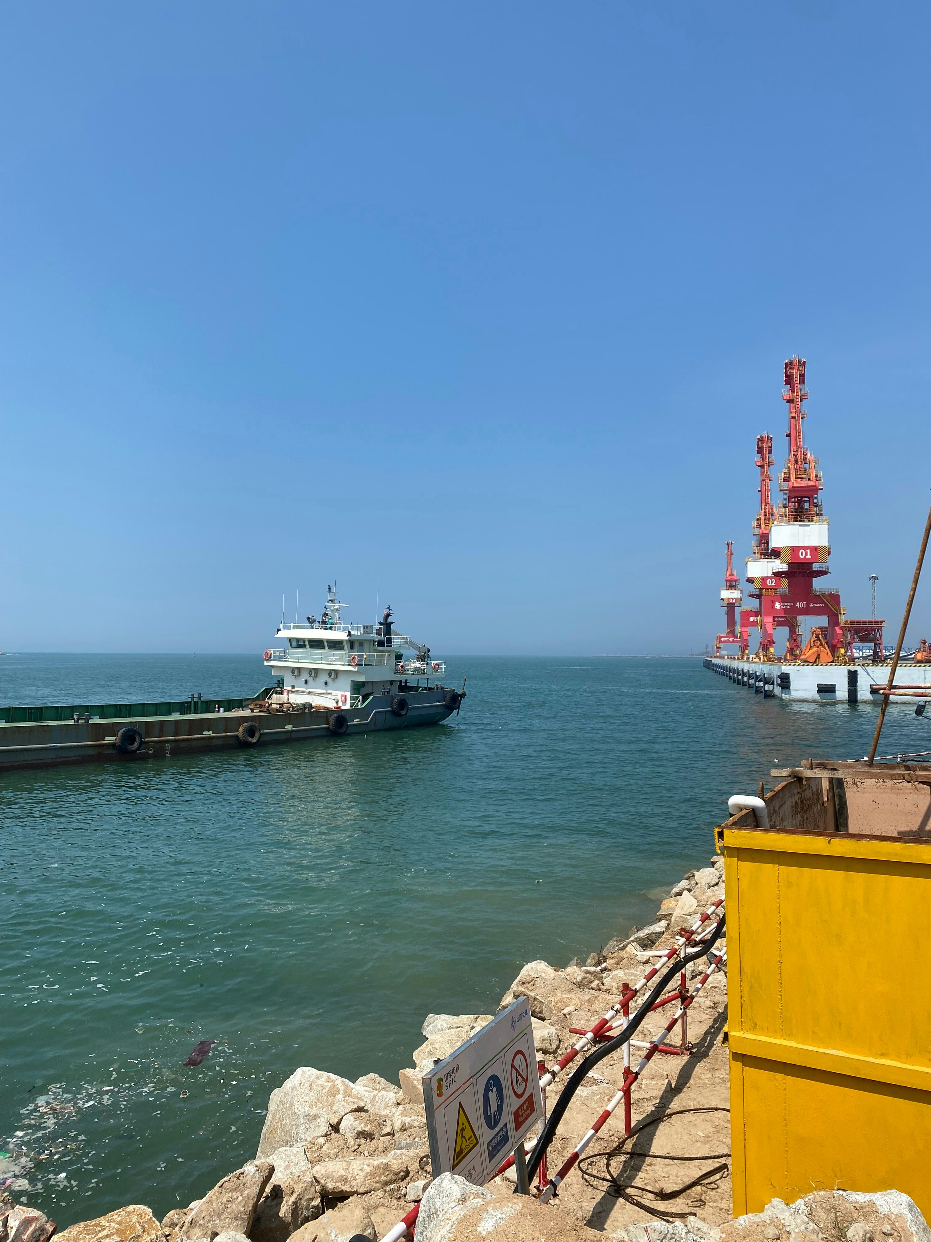 Harbor Outbound: Tugboat at Sea Under Clear Sky
