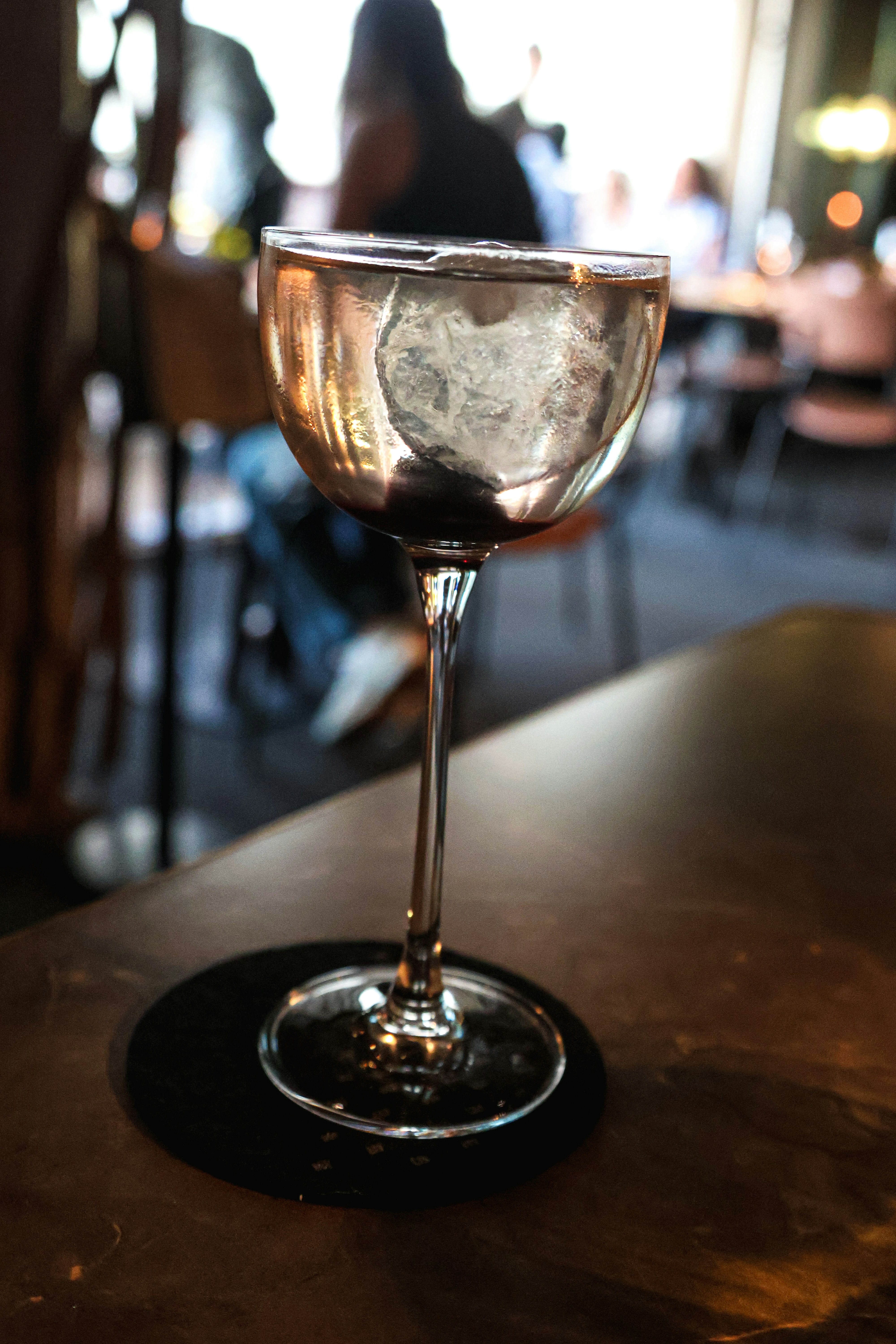 Glass of Evening Reflection in a Cozy Café