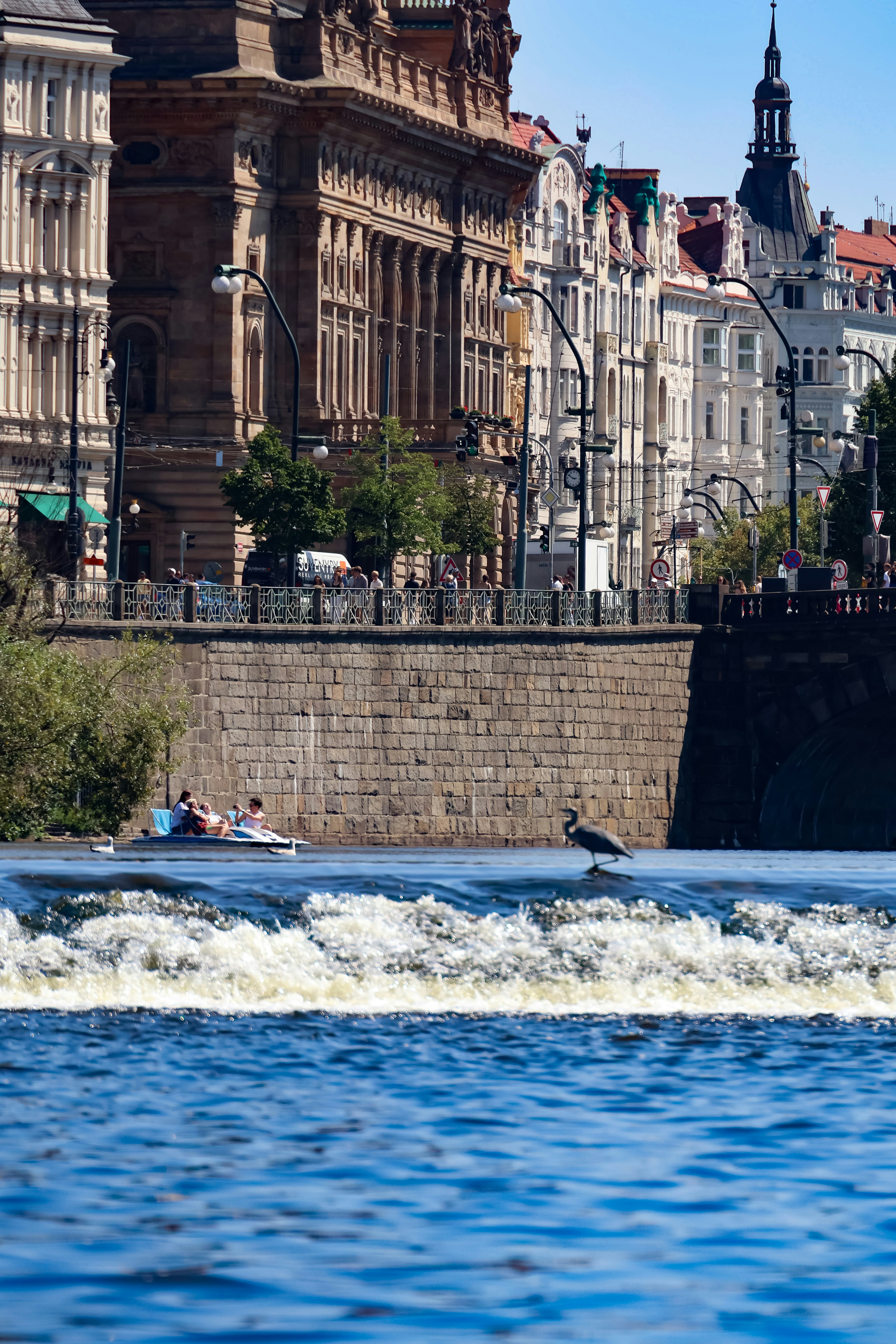 Riverside Facades and a Surf of City Life by the Water