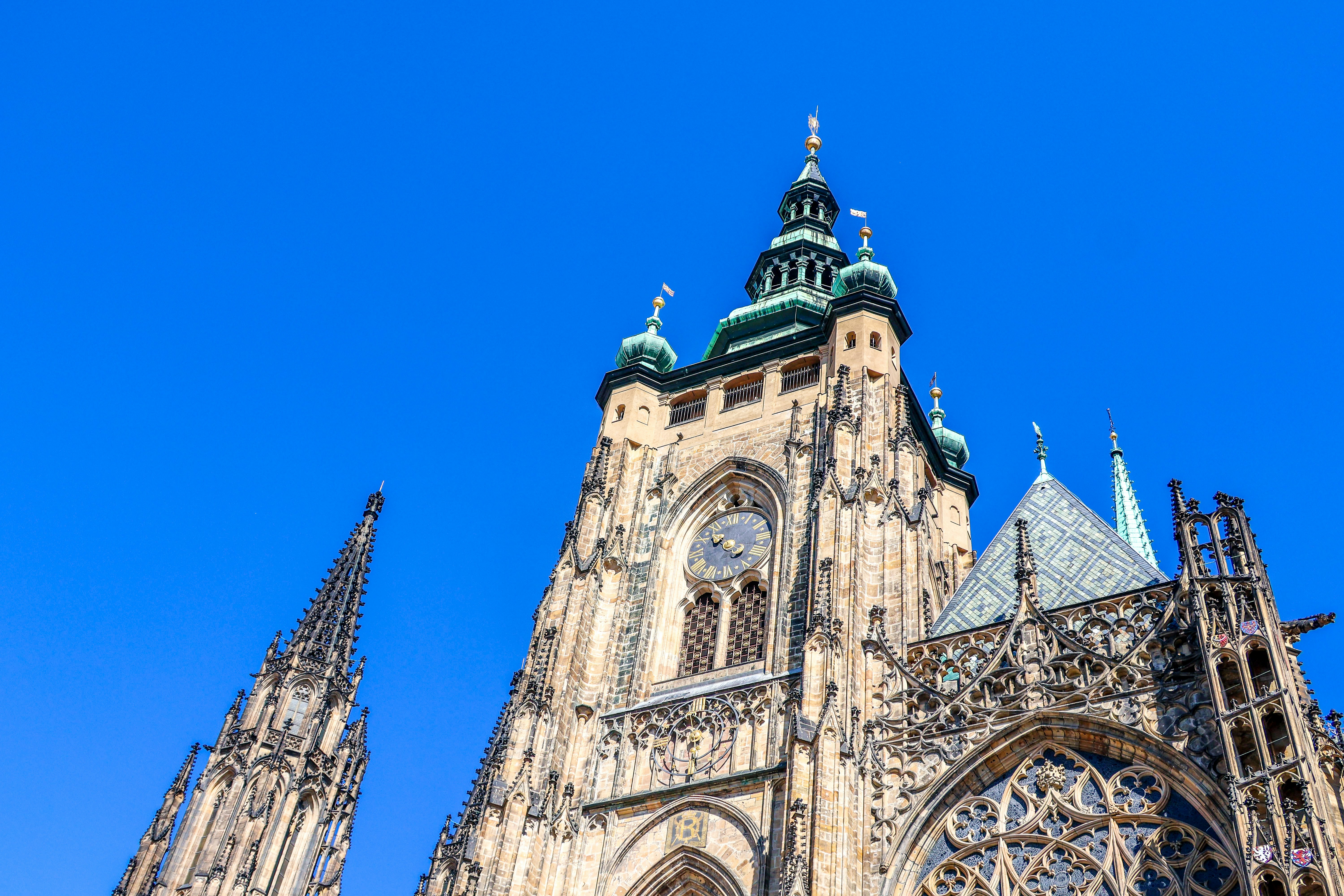 Gothic Grandeur: Facade and Spires Reaching Toward a Bluest Sky