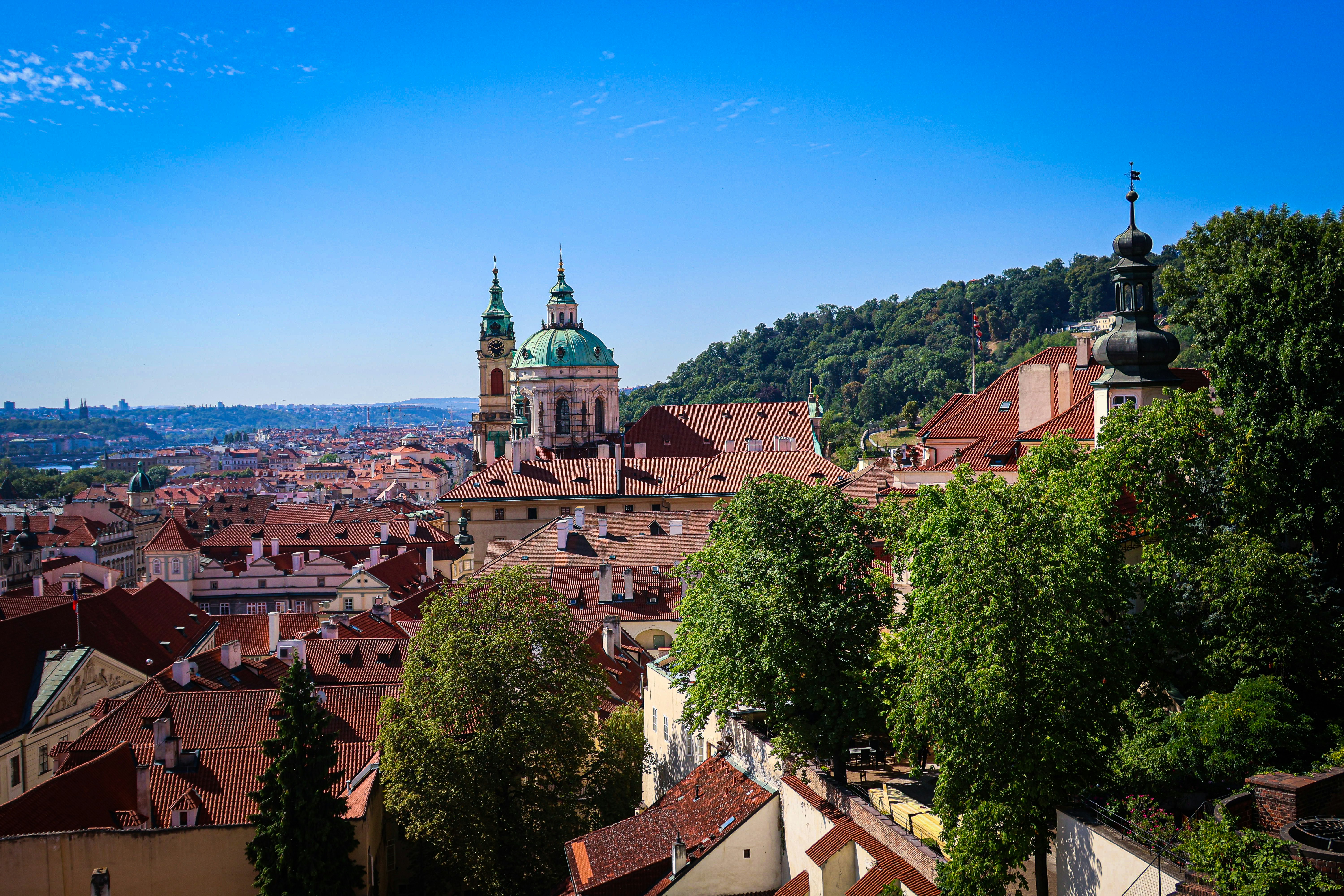 Rooftop Chorus Over Prague–style Skyline