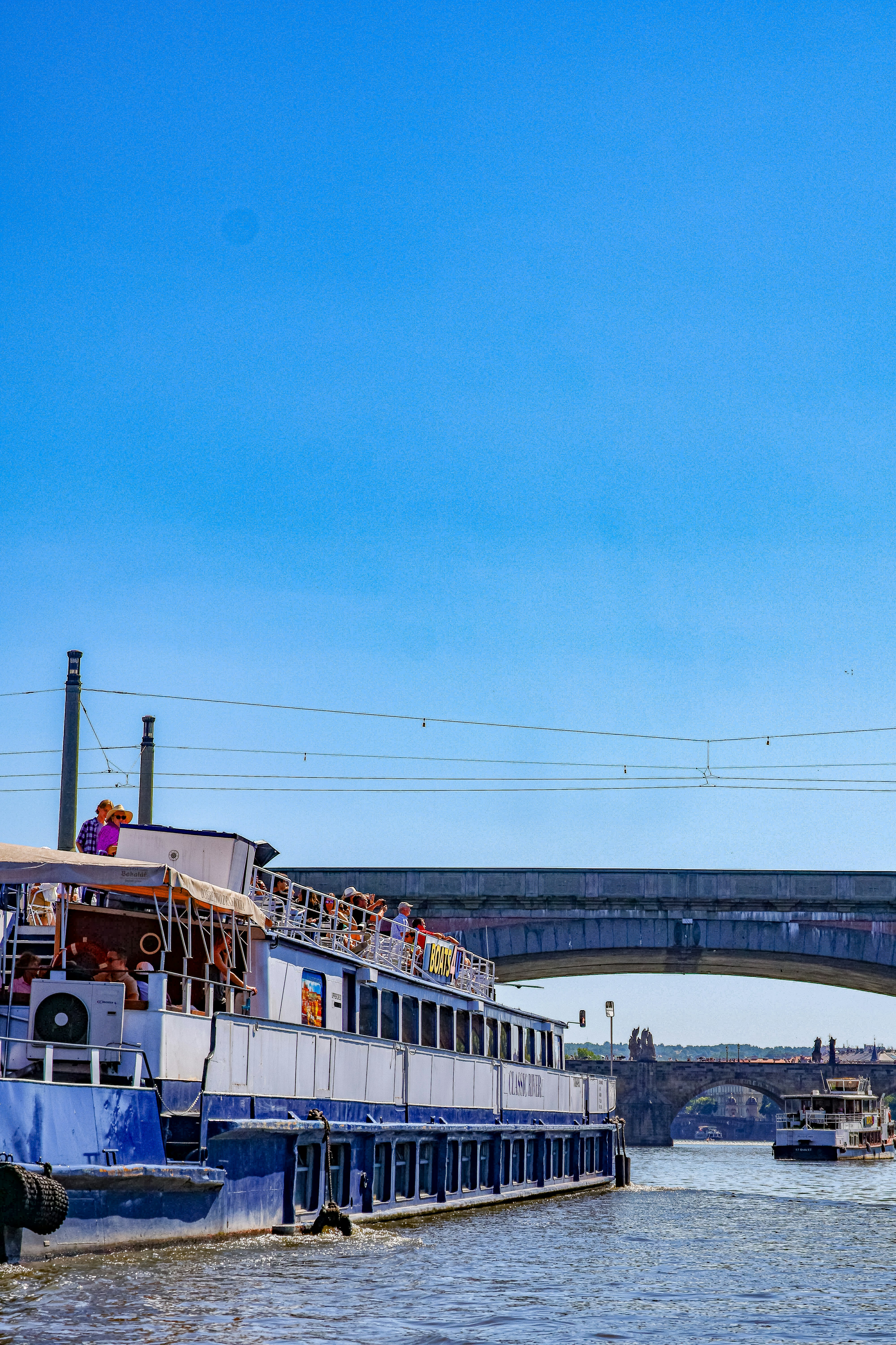 Riverine Vessel at Dusk: A Passenger Boat Along the Harborside