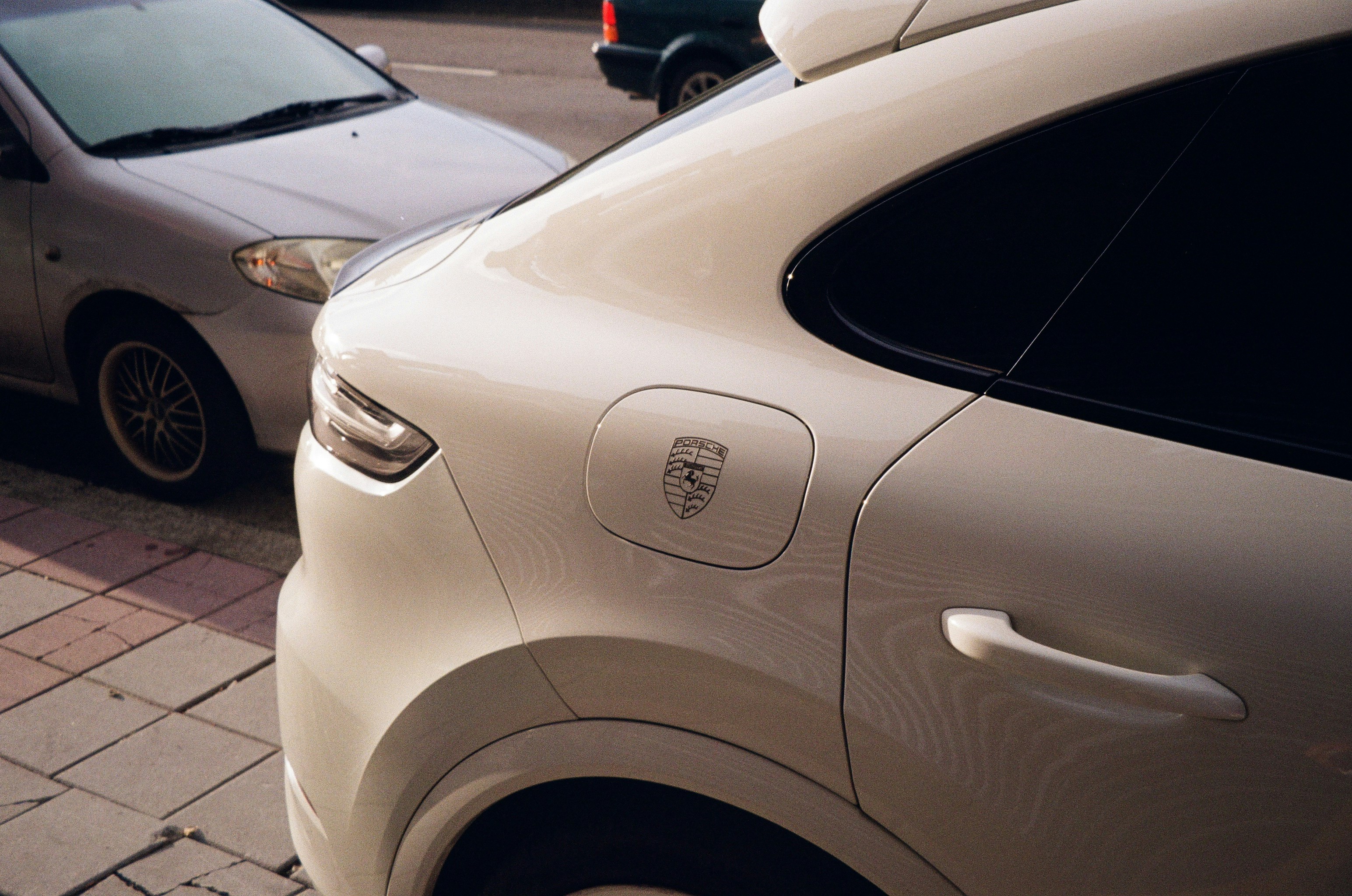 Close-Up of a Premium SUV Badge on a Cream Exterior