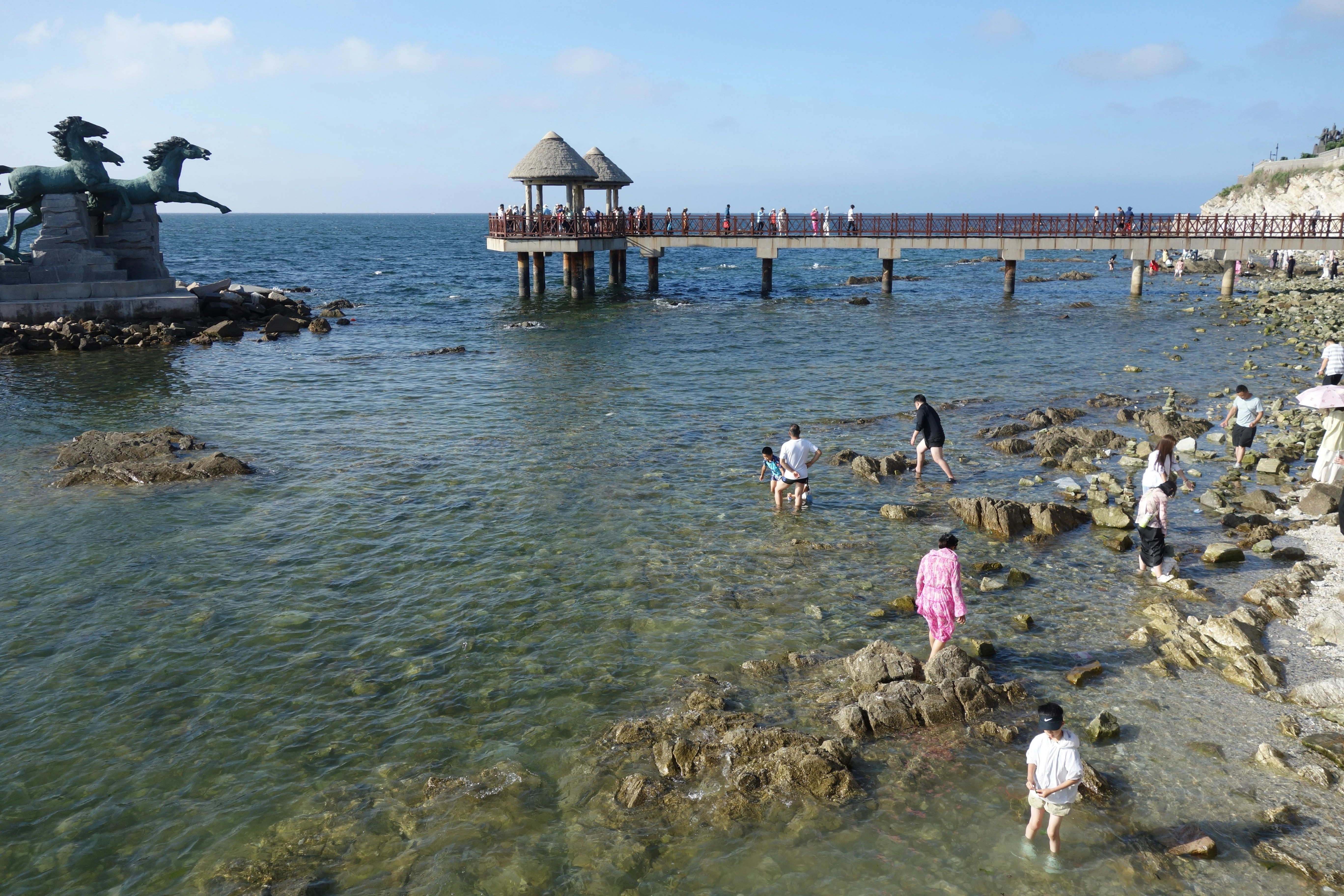 Pier under the gazebo: a sunlit seafront gathering