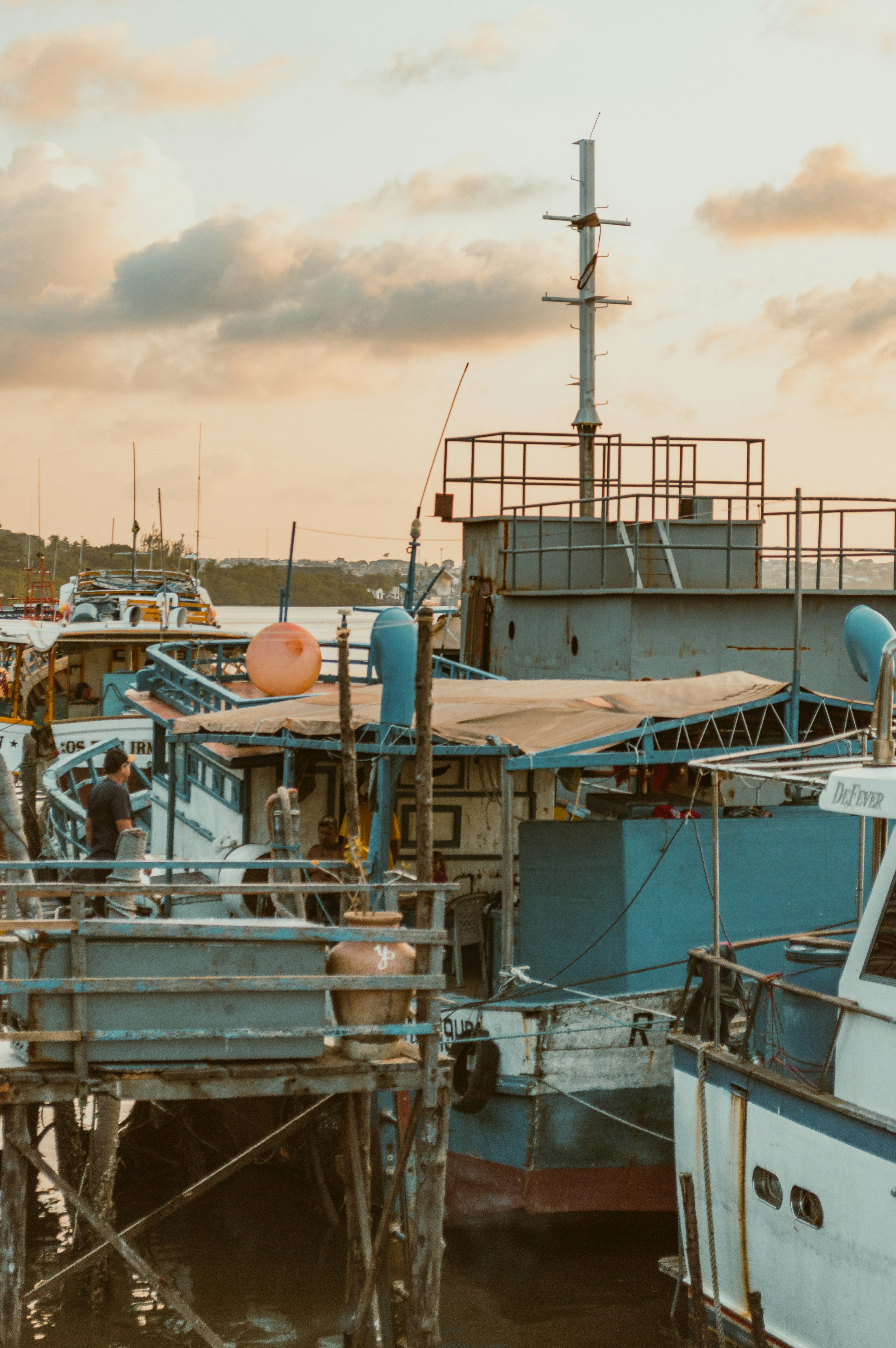 Maritime Terrace: Weathered Boats and Docks in A Sunset Tide