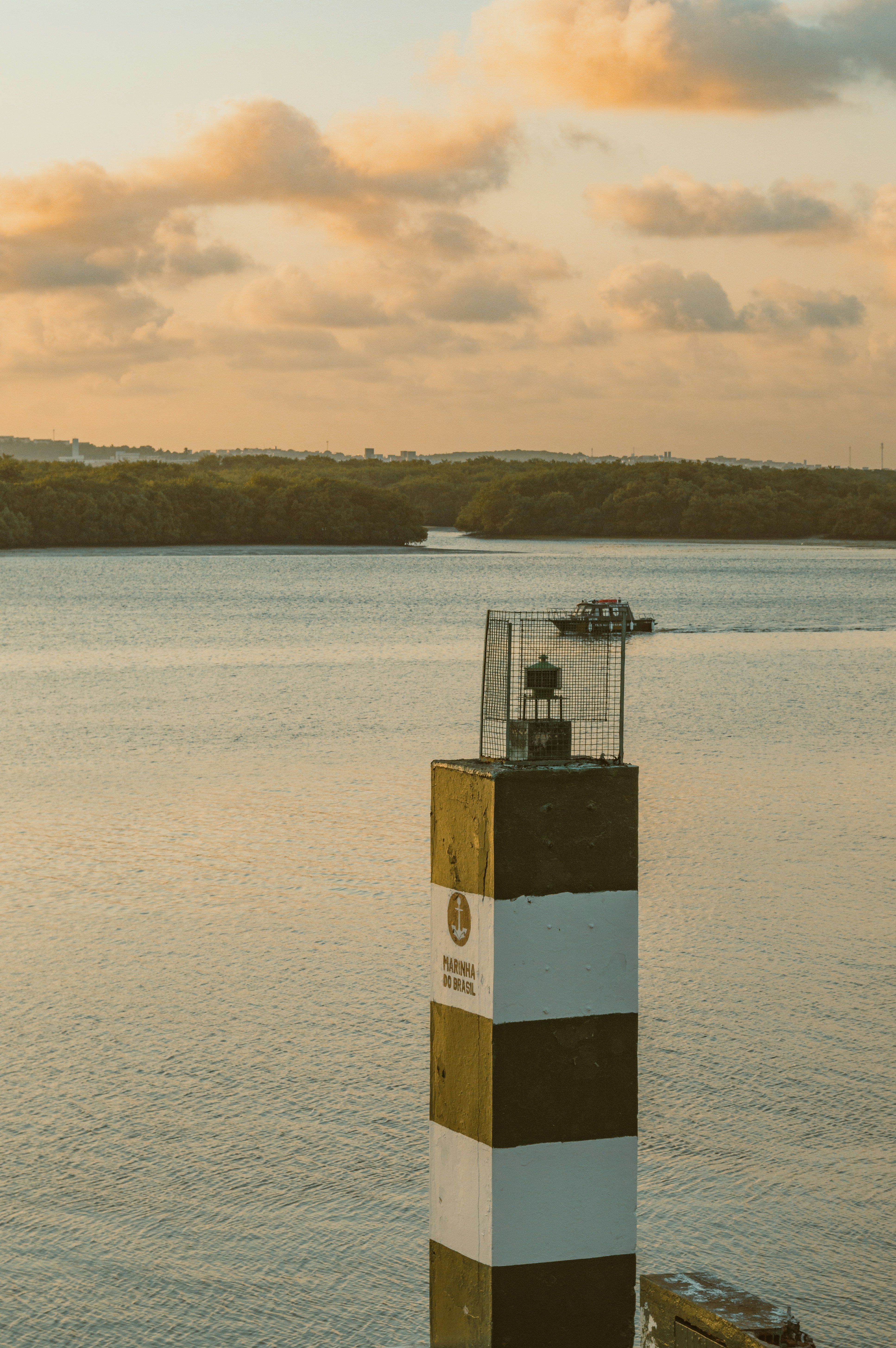 Golden Hour Beacon: A Coastal Structure Reaches Toward the Sky
