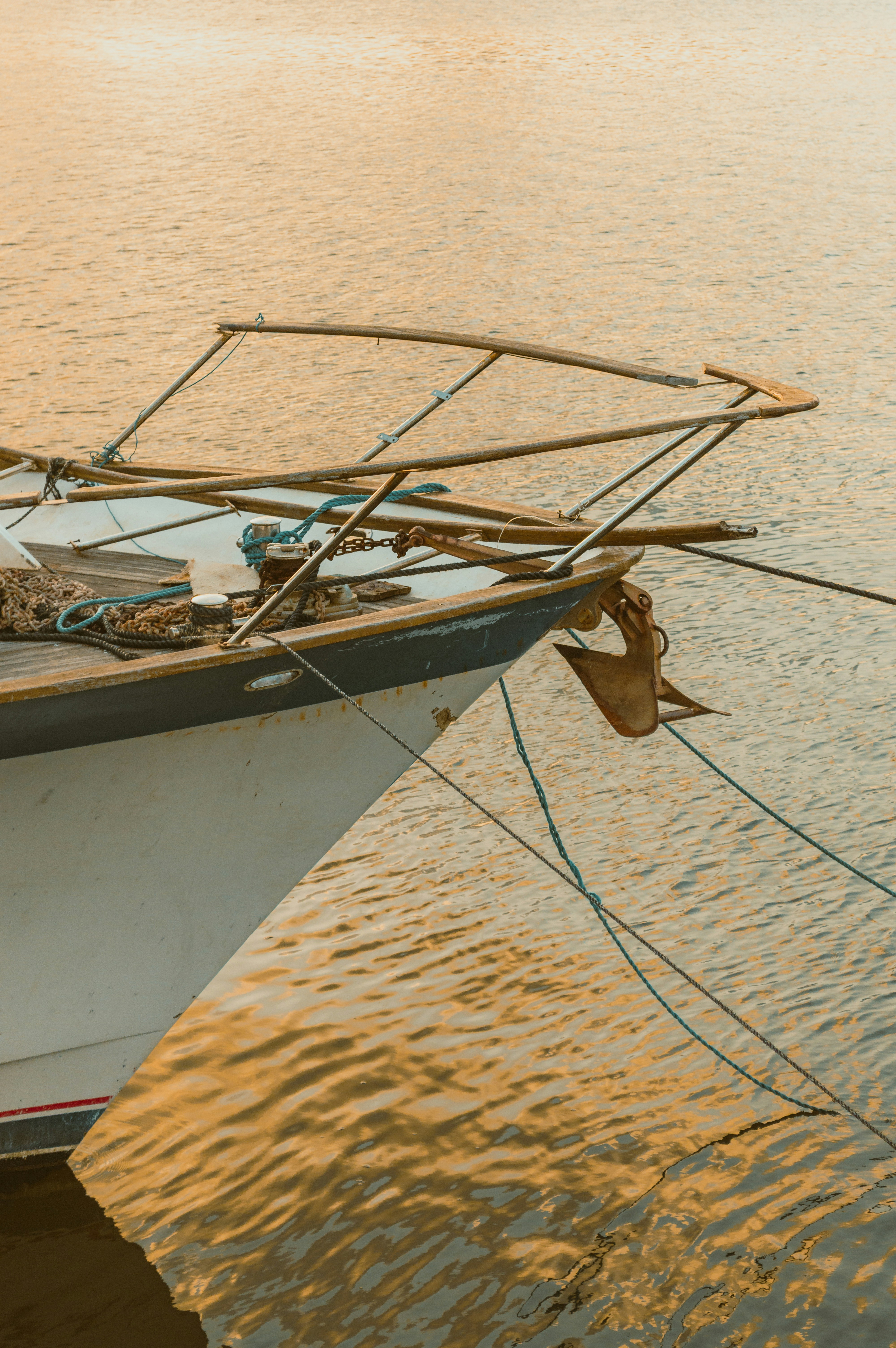 Bow of a Tranquil Dock: Golden Reflections on Quiet Waters