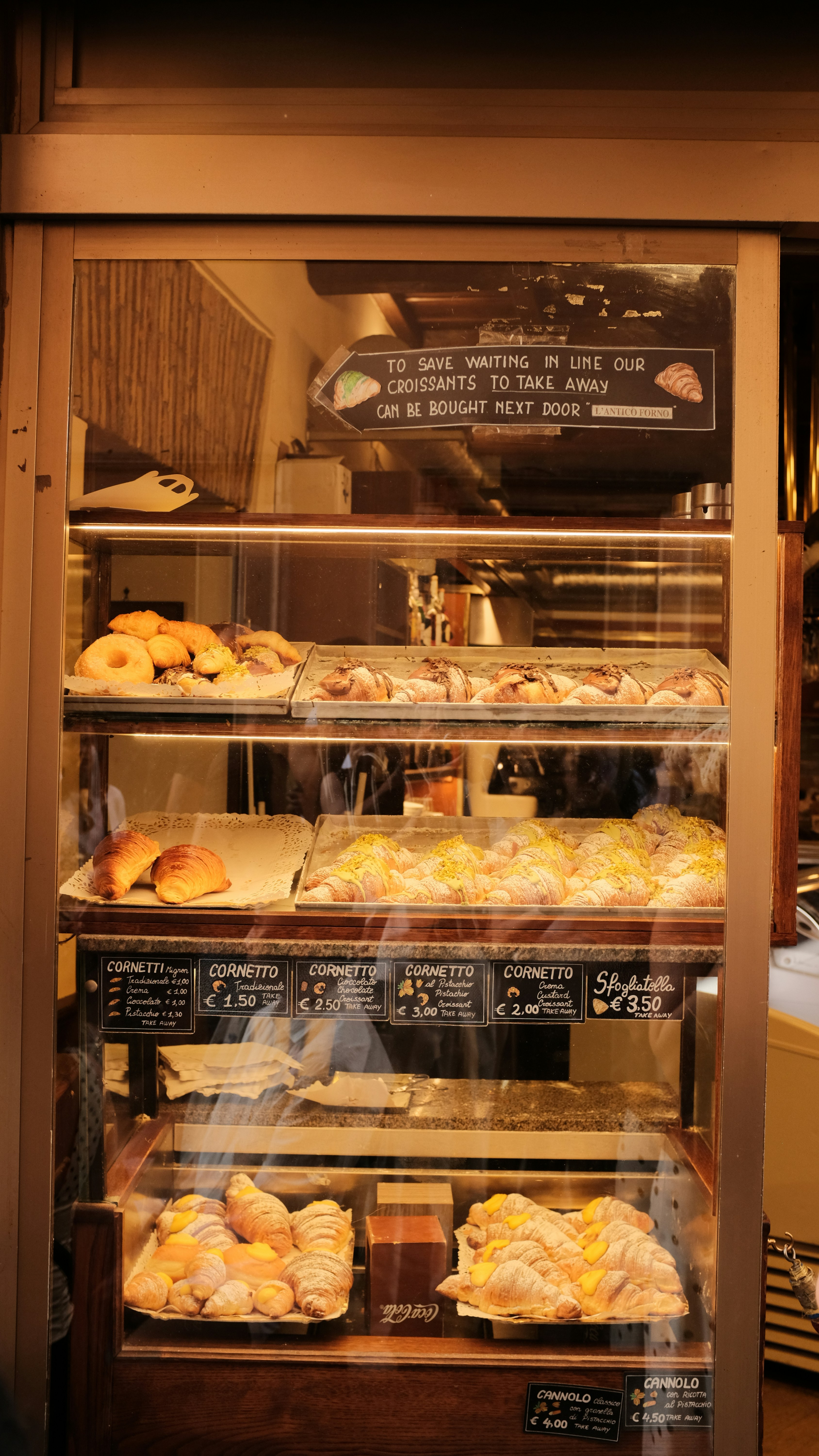 Warm Glass Case of Morning Pastries