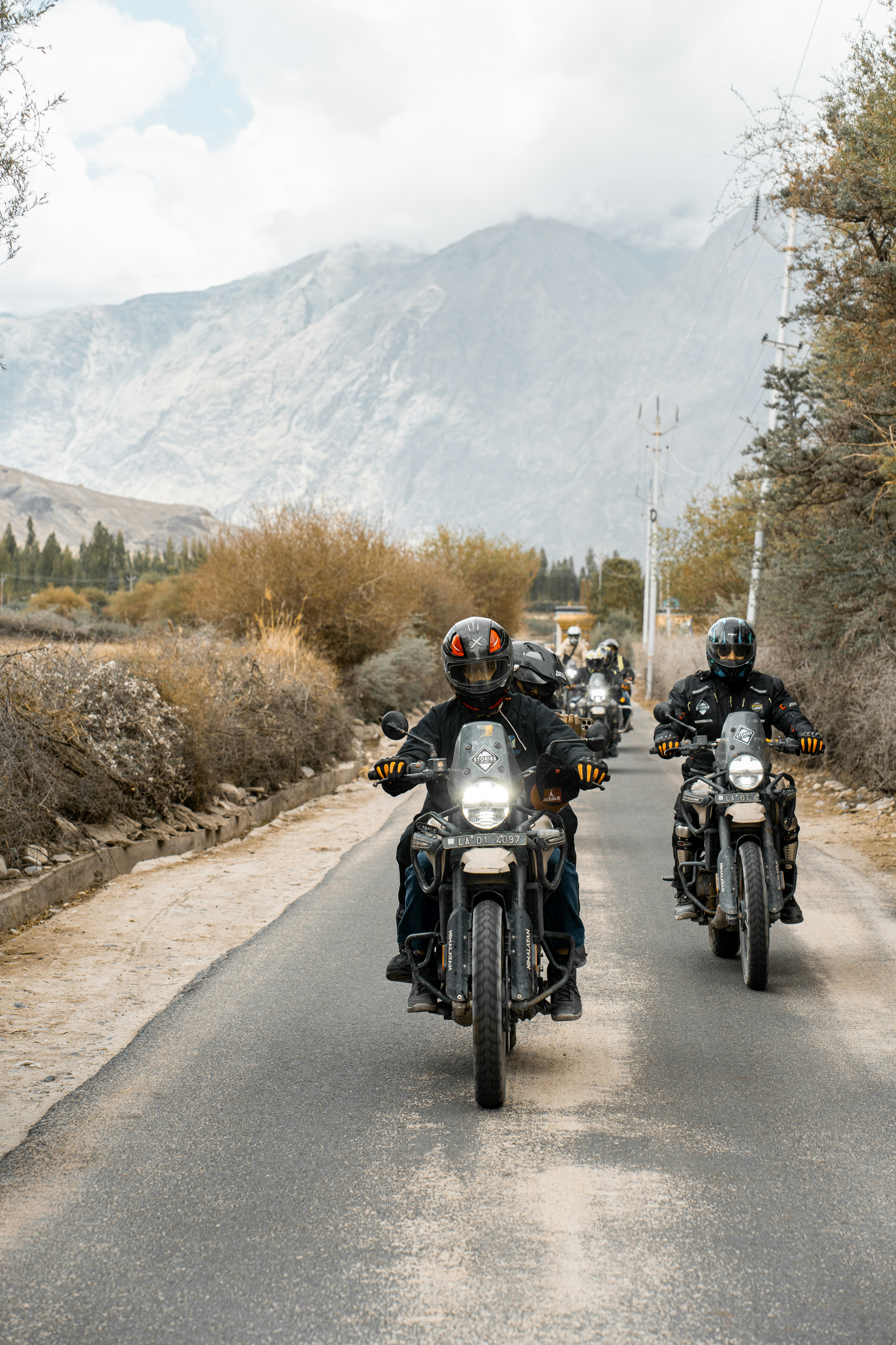 Mid-Road Parade: Motorcycles marches toward the camera under aierra backdrop
