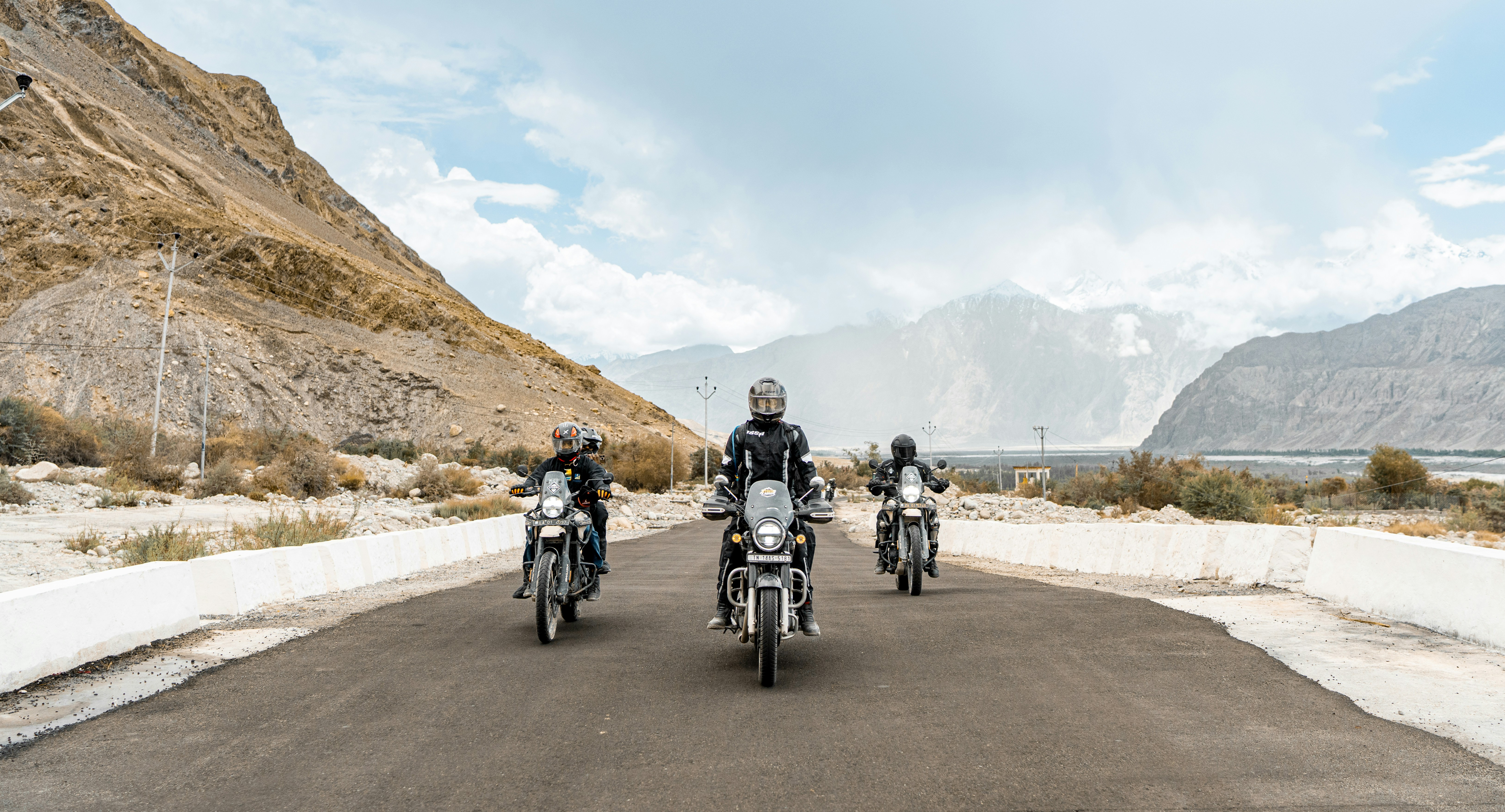 Triad on the Tarmac: Riders Driving Through a Desert Pass