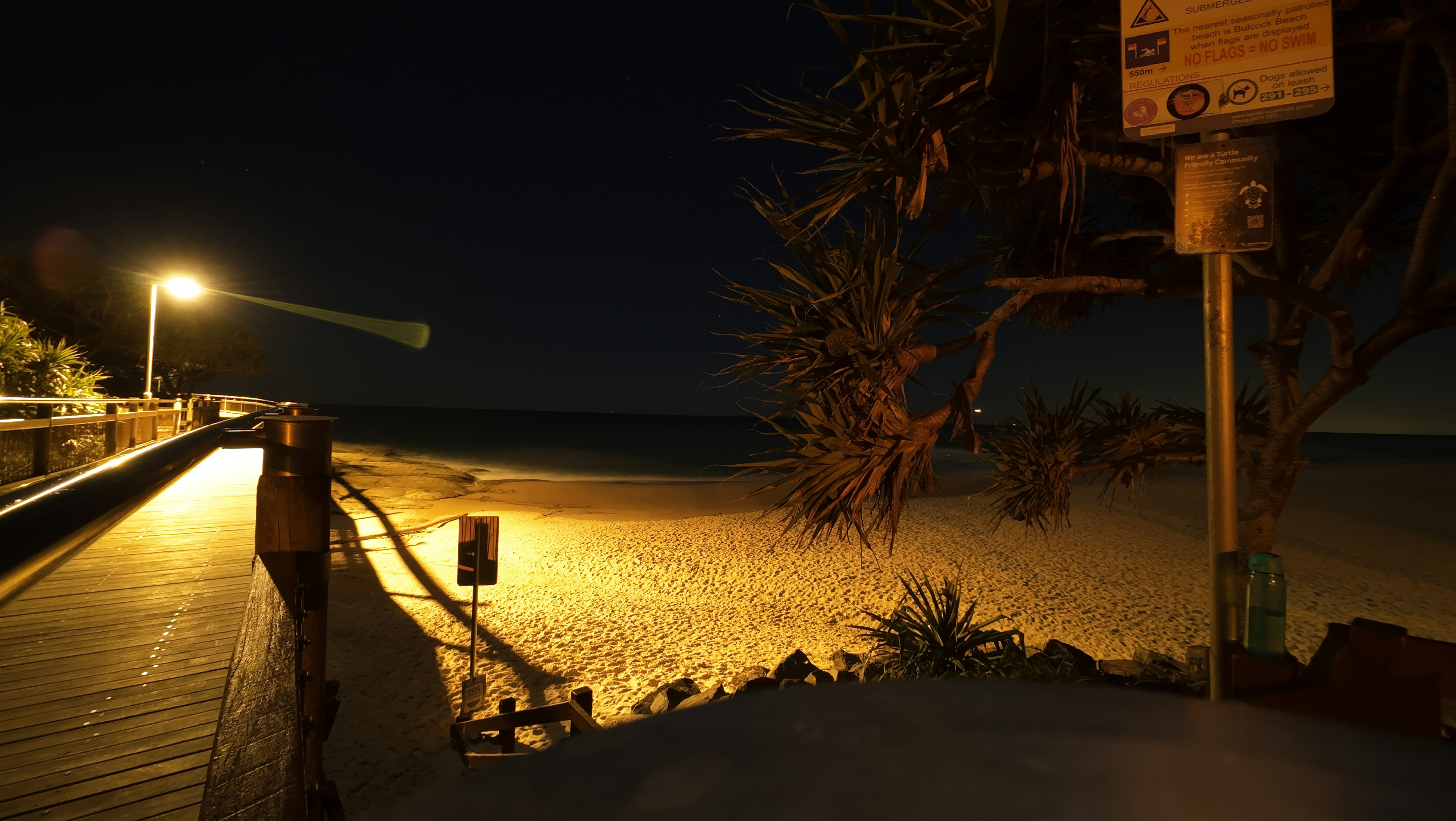 Moonlit Boardwalk Over Quiet Sands