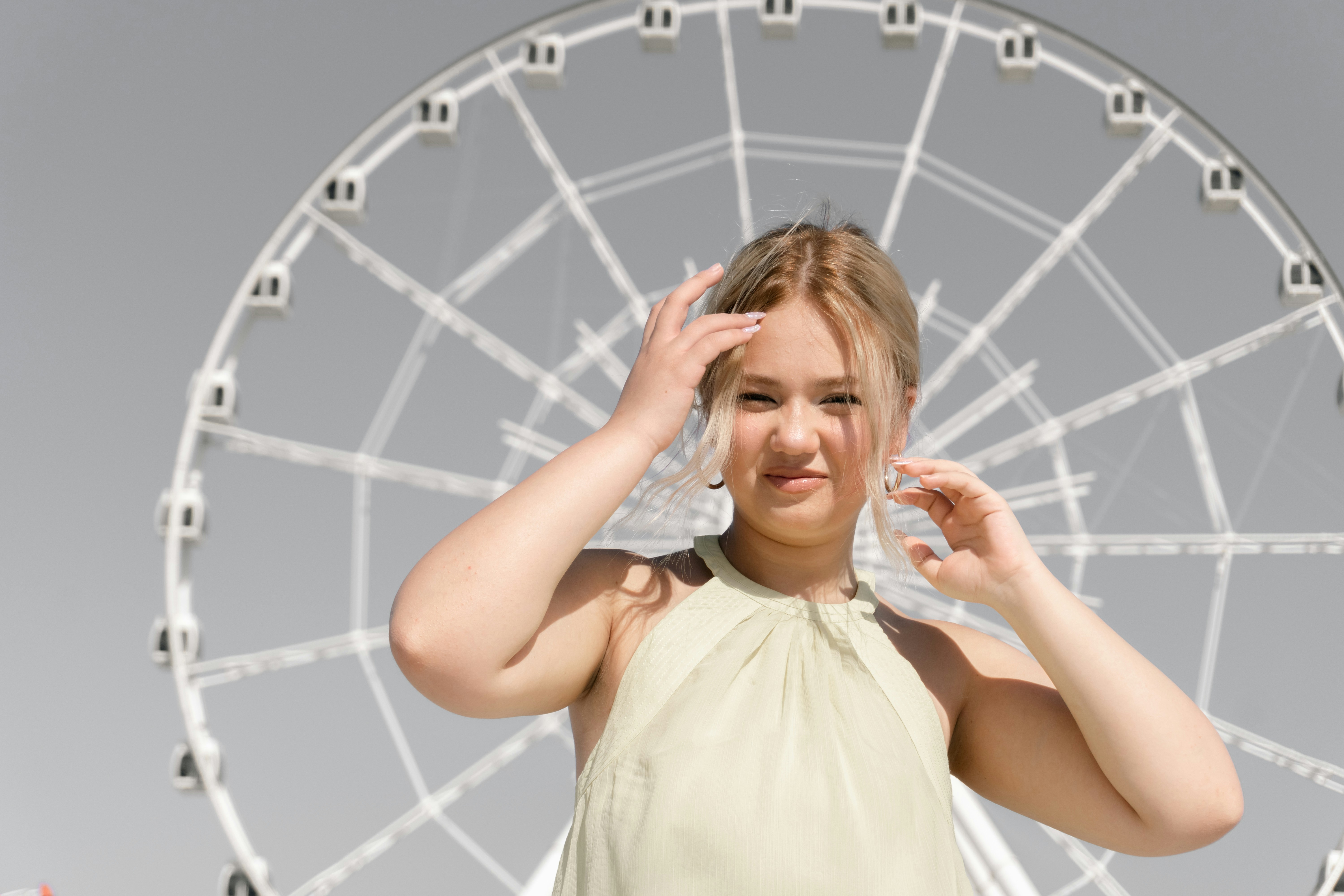 Ferris Wheel Glow: A Portrait Beneath the City’s Giant Wheel