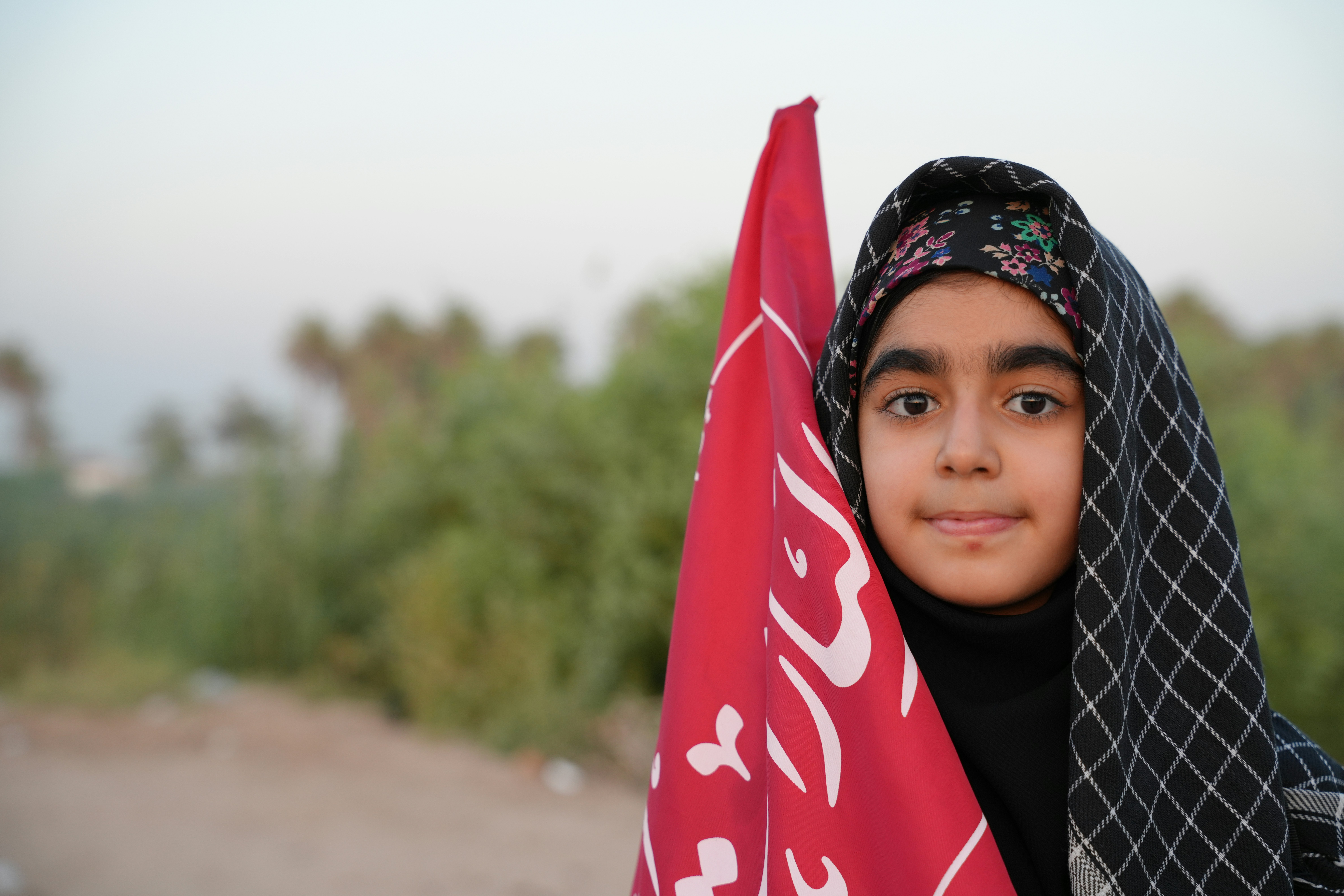 Portrait Banner: A Quiet Gaze Under a Patterned Veil