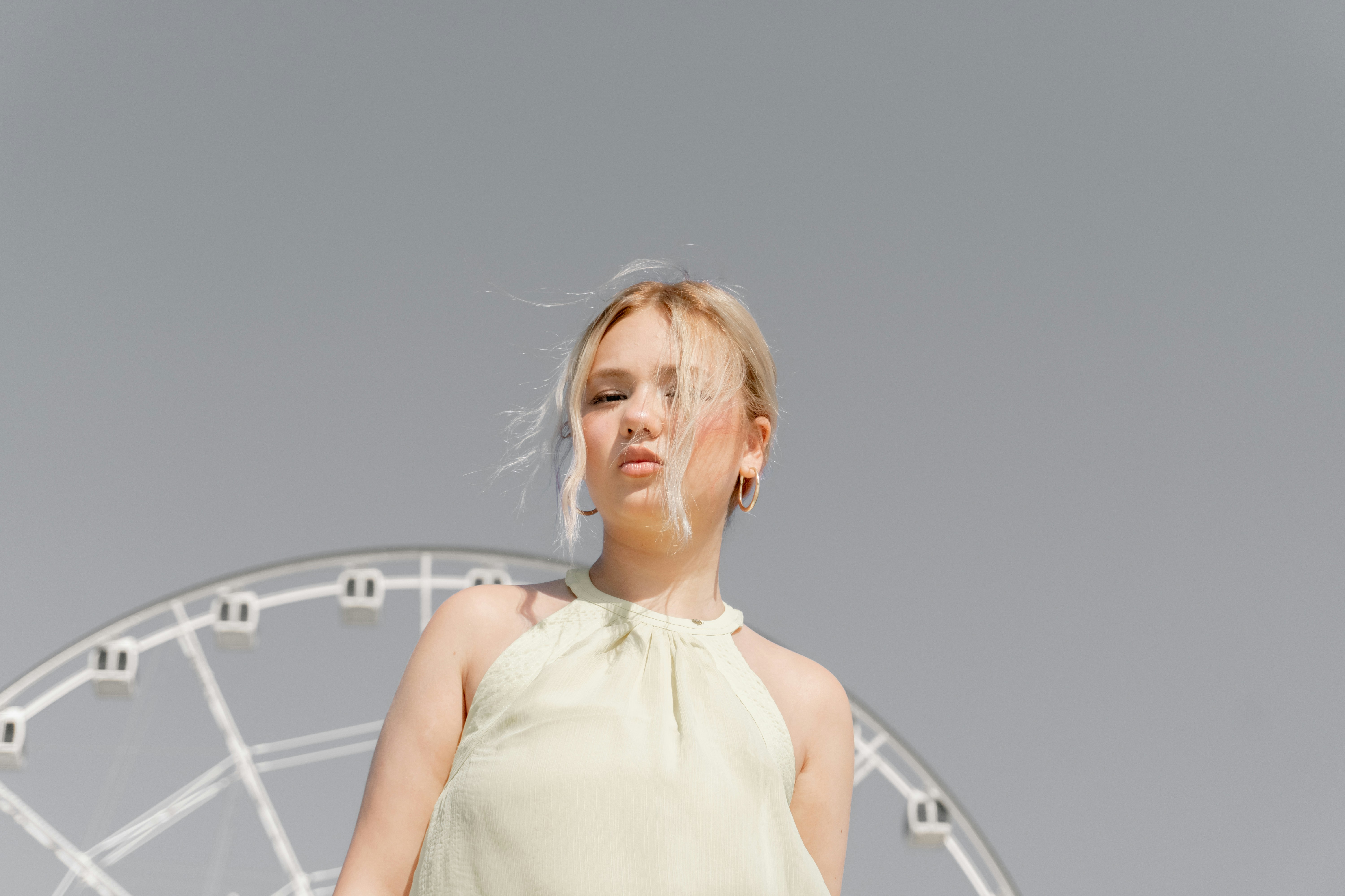 Sunlit Contemplation Under the Ferris Wheel