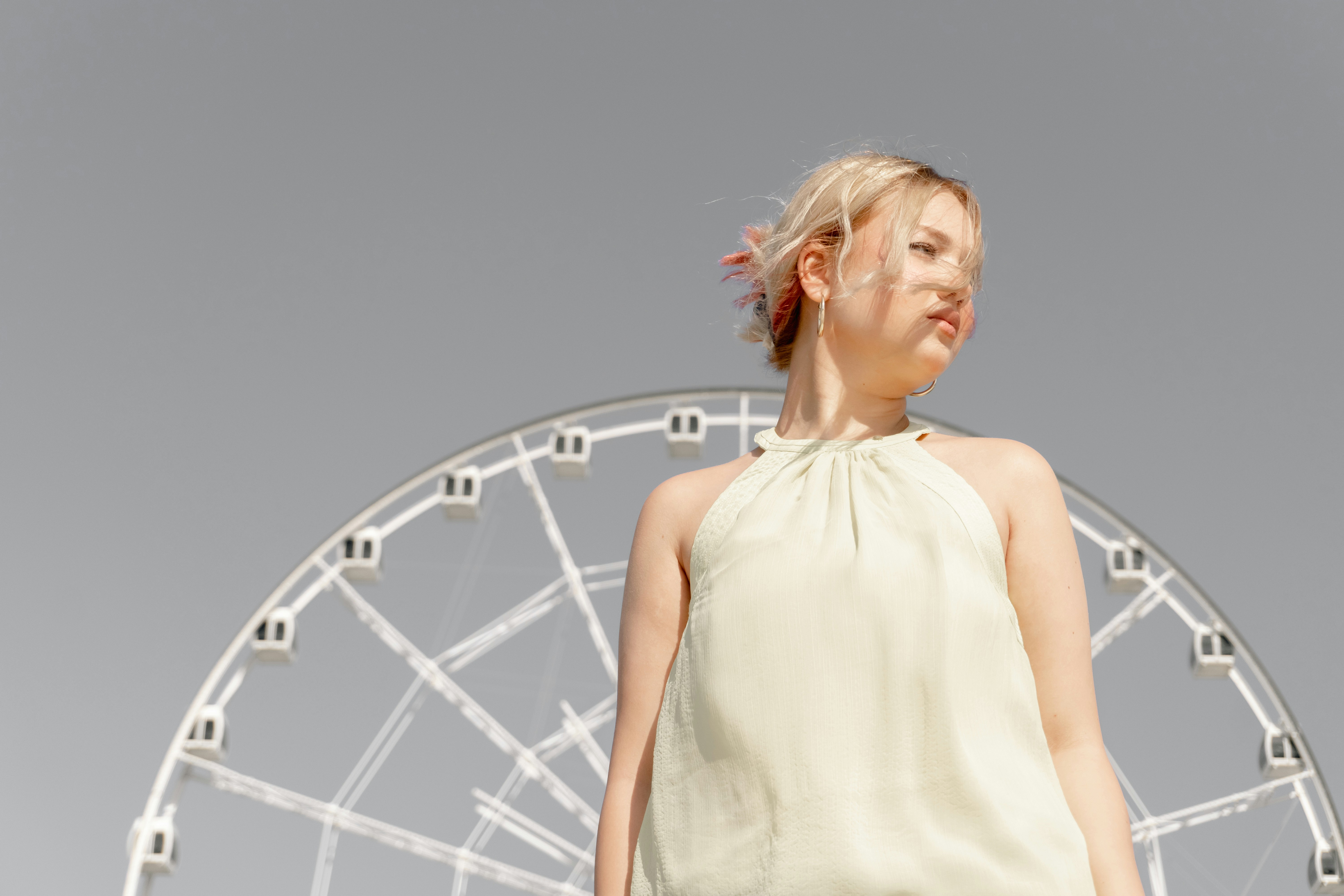 Sunlit Portrait at the Edge of a Ferris Wheel