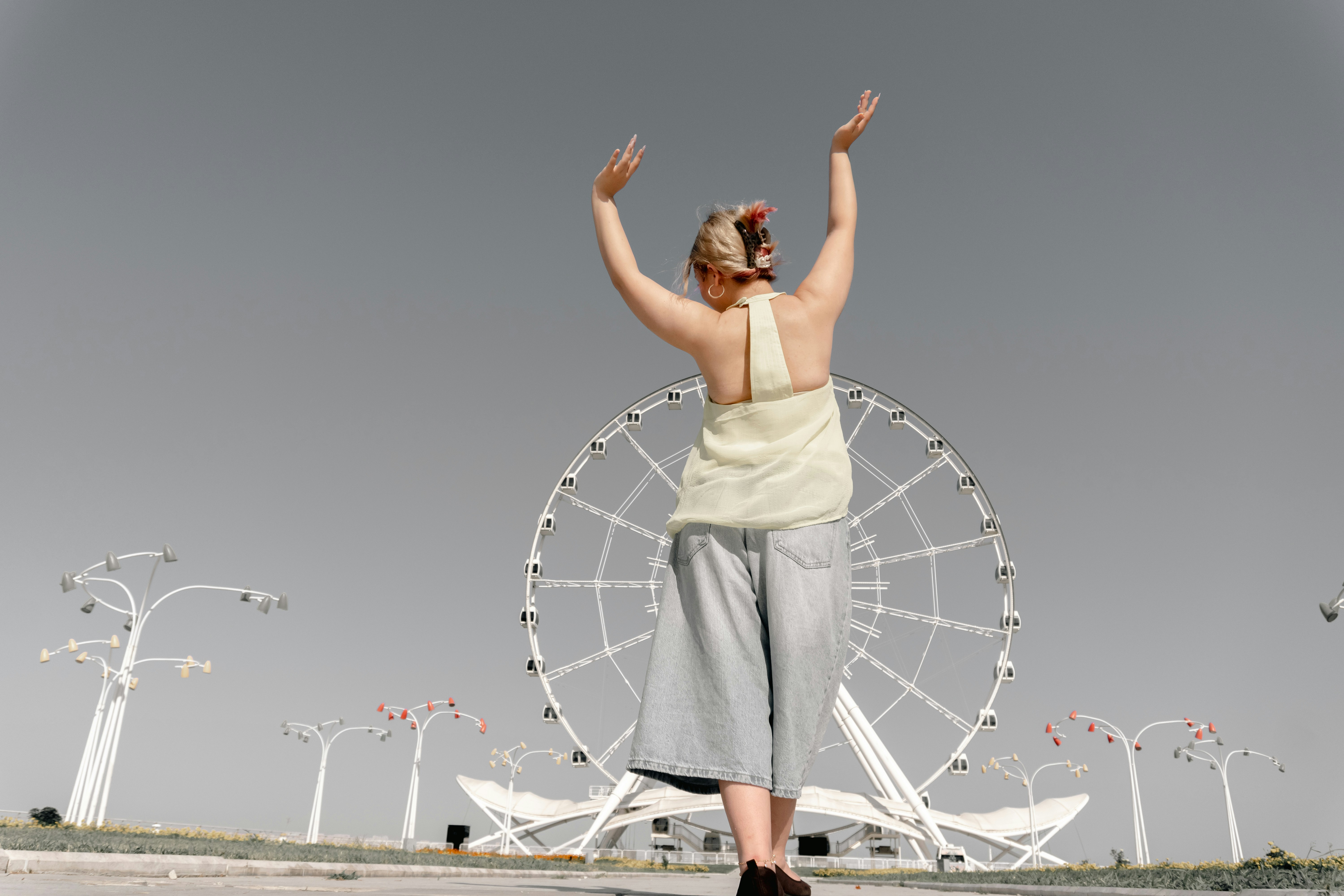 Dancer Beneath the Giant Wheel
